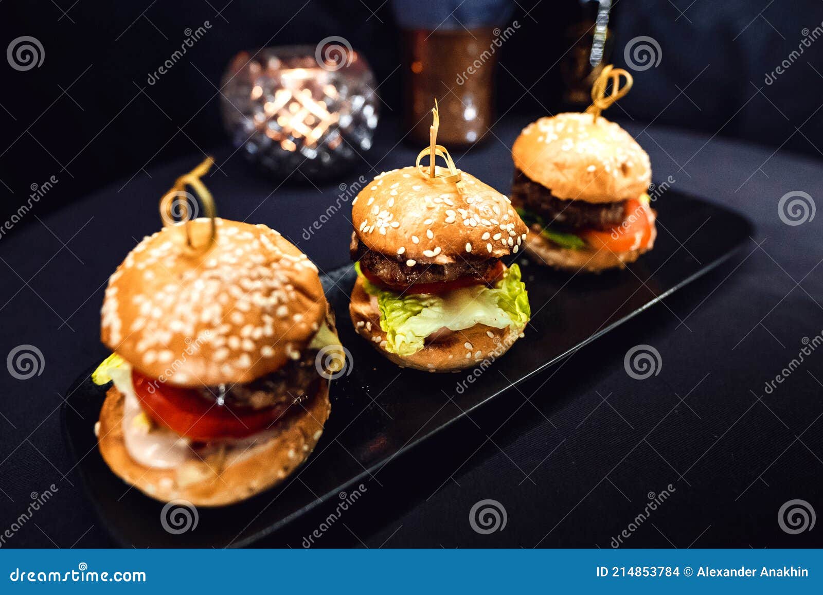 Three Mini Burgers on a Black Rectangular Elongated Stand. Stock Photo ...