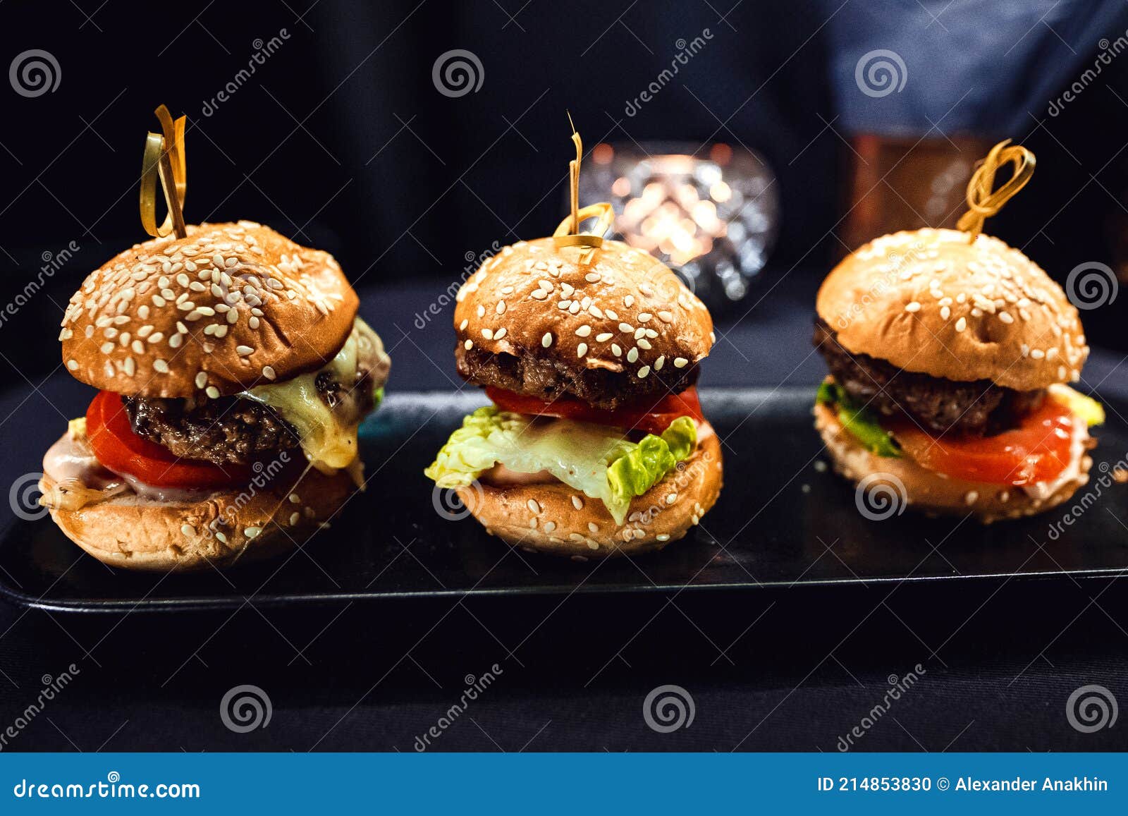 Three Mini Burgers on a Black Rectangular Elongated Stand. Stock Photo ...