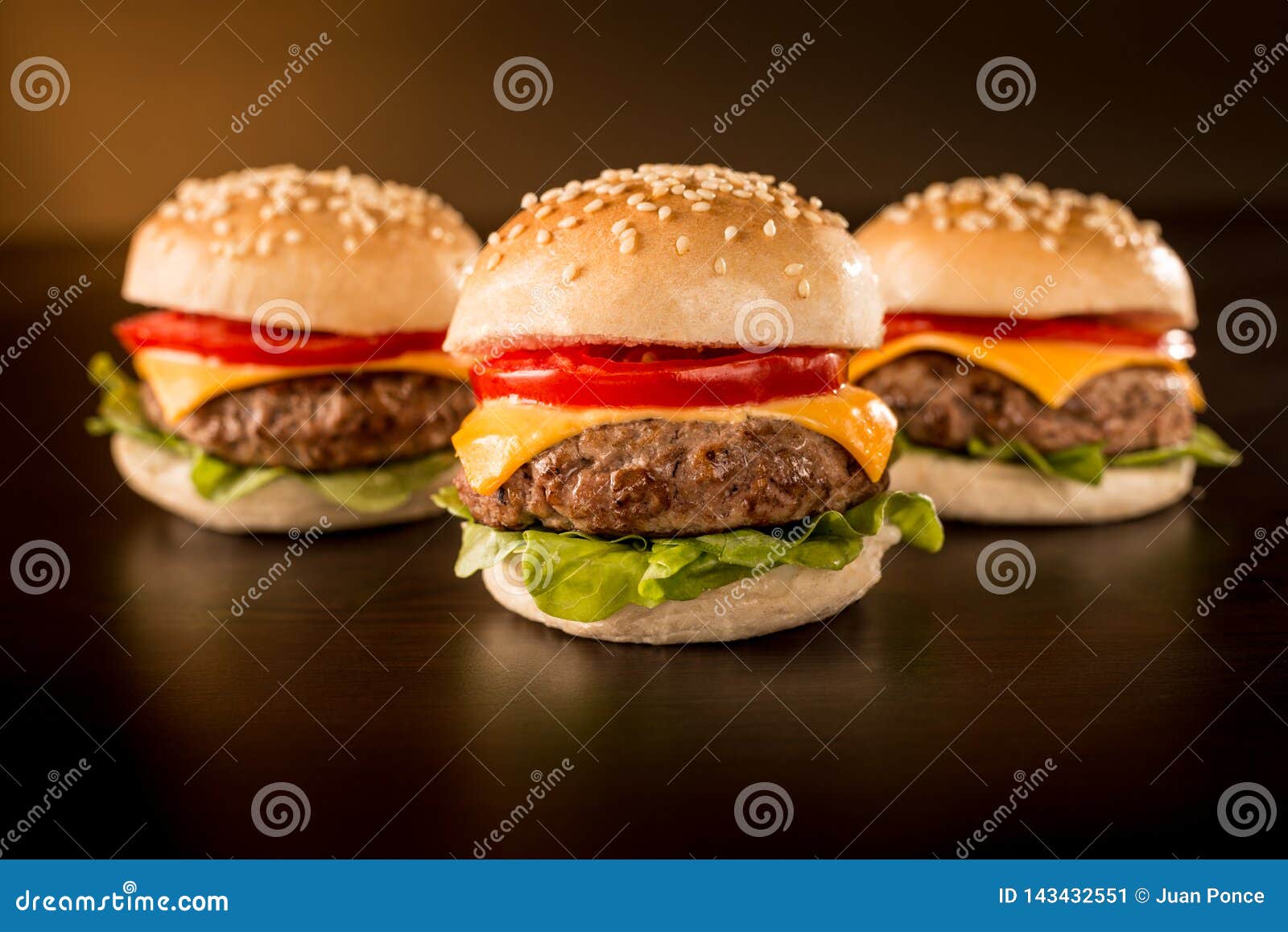Three Mini Burgers in a Dark Ambient Stock Image - Image of fresh ...