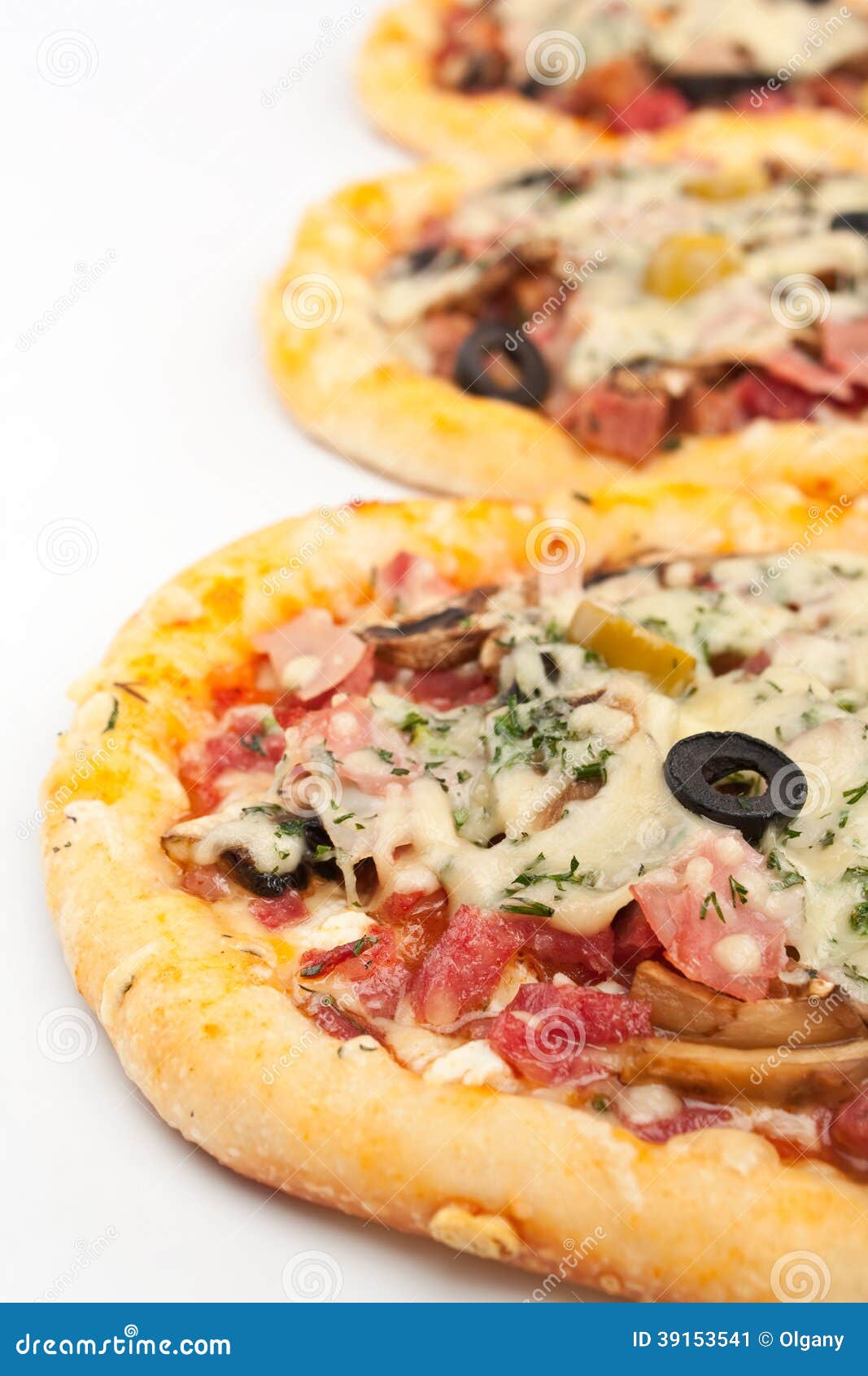 Three Mini Pizzas in a Row stock image. Image of mozzarella - 39153541