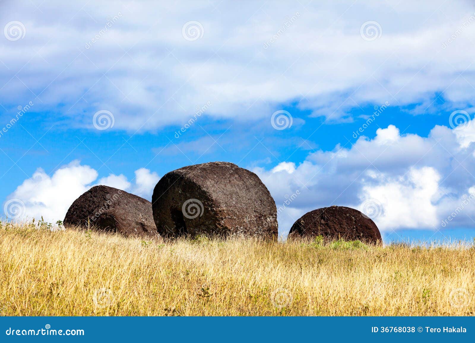 Three Moai Hats on Field in Easter Island Stock Photo - Image of blue ...