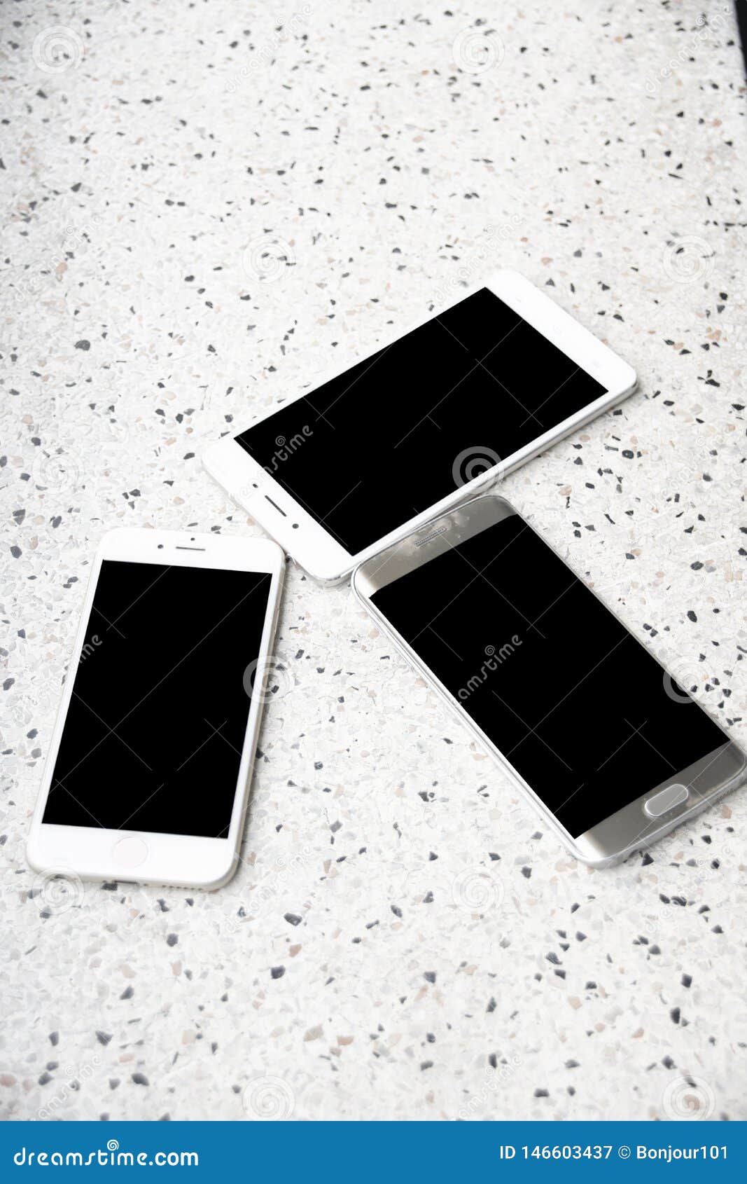 Three Mobile Phones are Placed on the Marble Floor Stock Image - Image ...