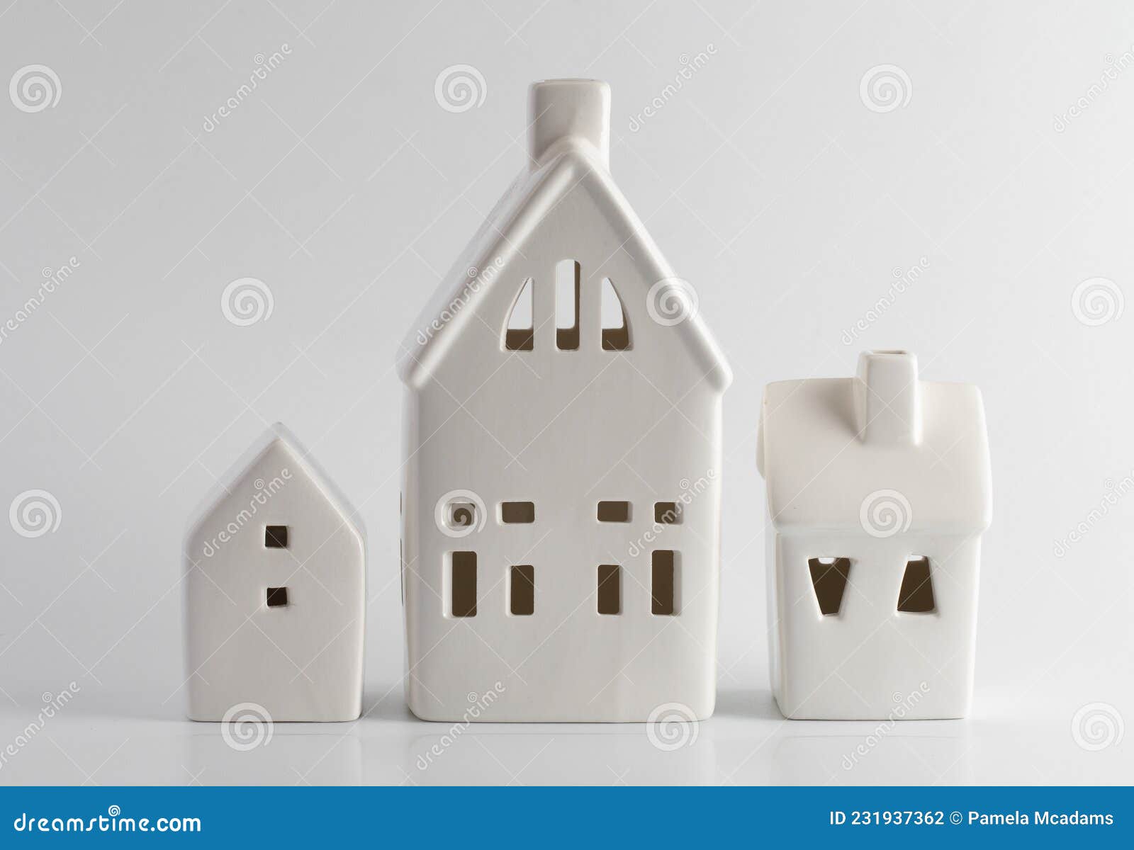 Three Model Homes in a Row Isolated on a White Background Stock Photo ...