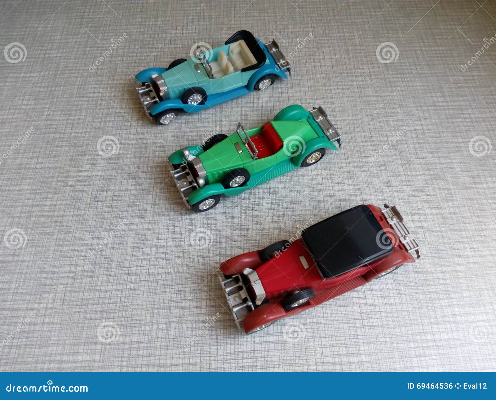 Three Models of Multi-colored Old Car on a Gray Background Stock Photo ...