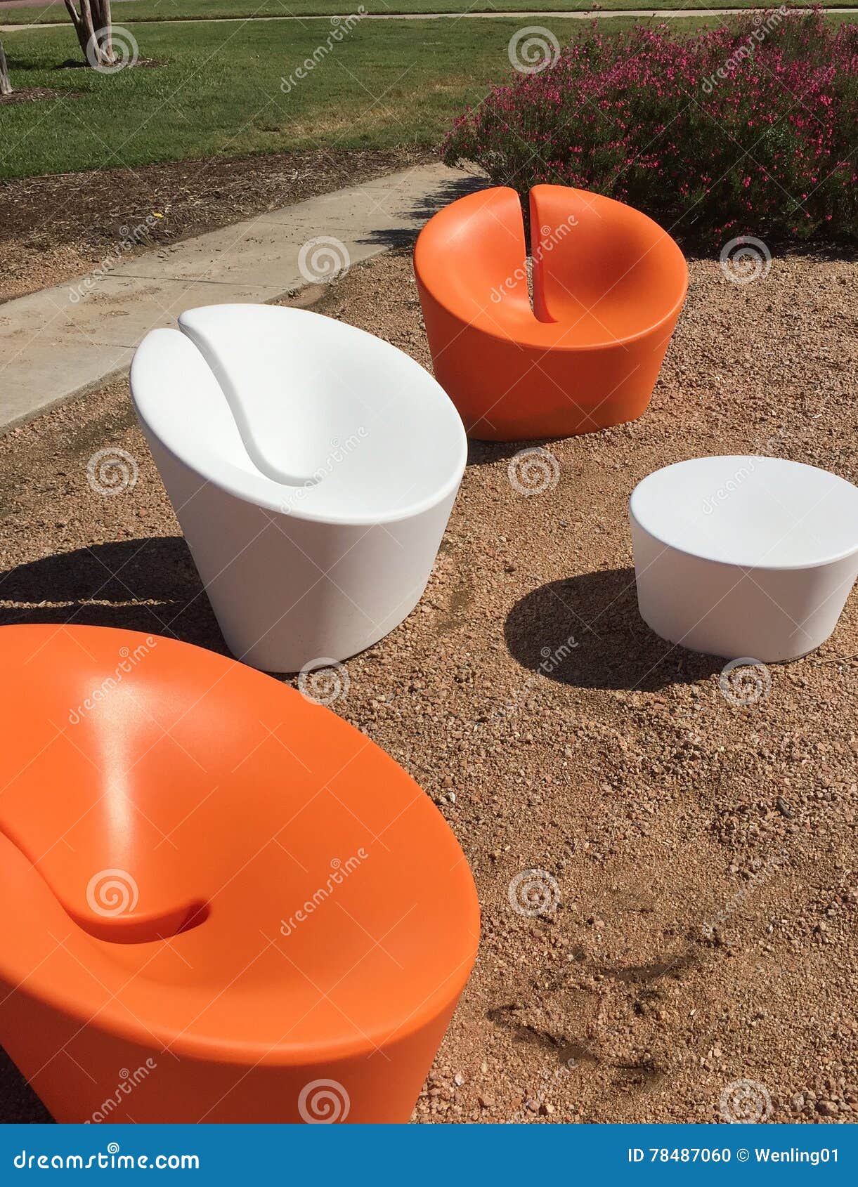 Three Modern Design Chairs and Table in a Park Stock Photo - Image of ...