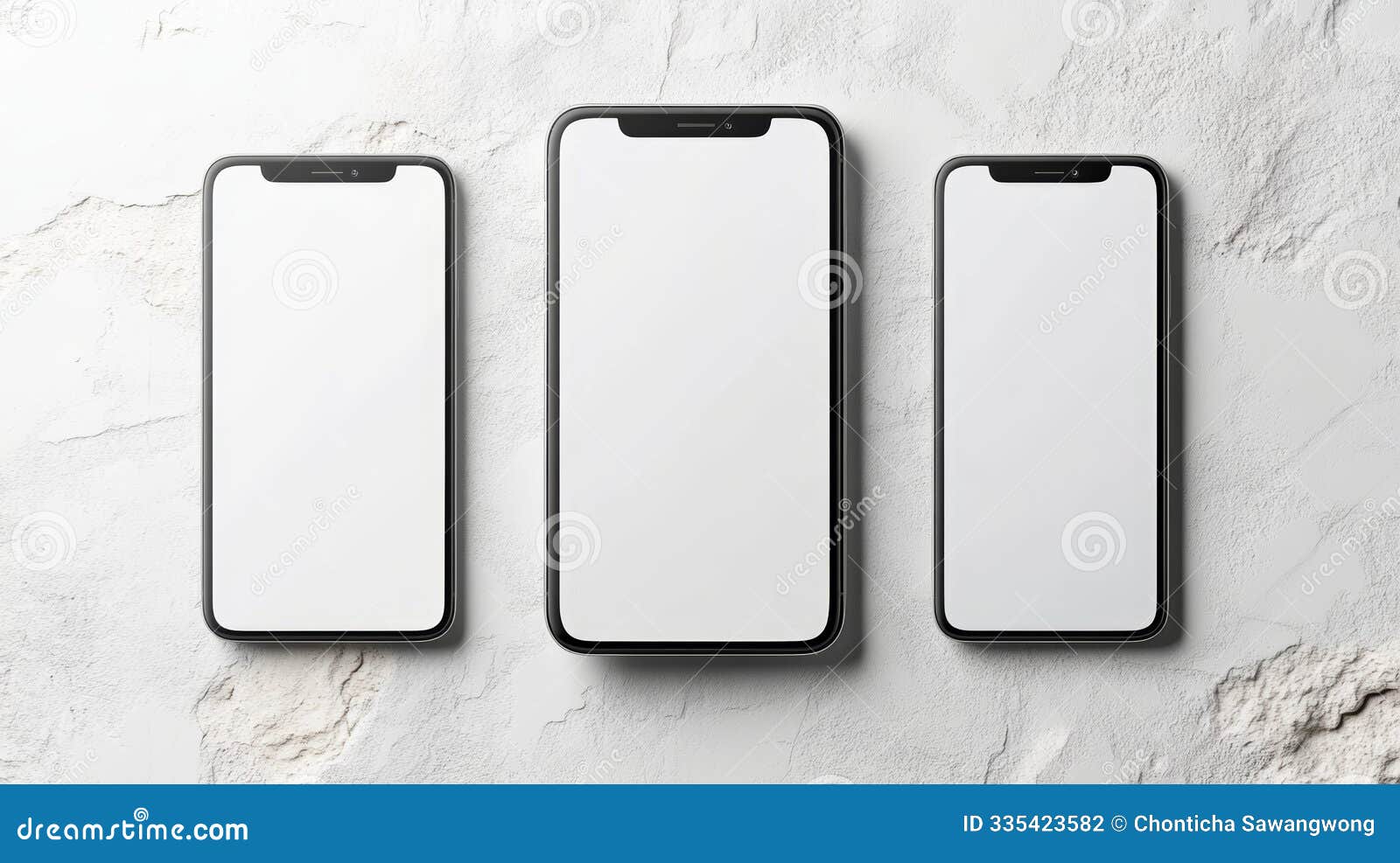 Three Modern Smartphones with Blank Screens Arranged on a Textured ...