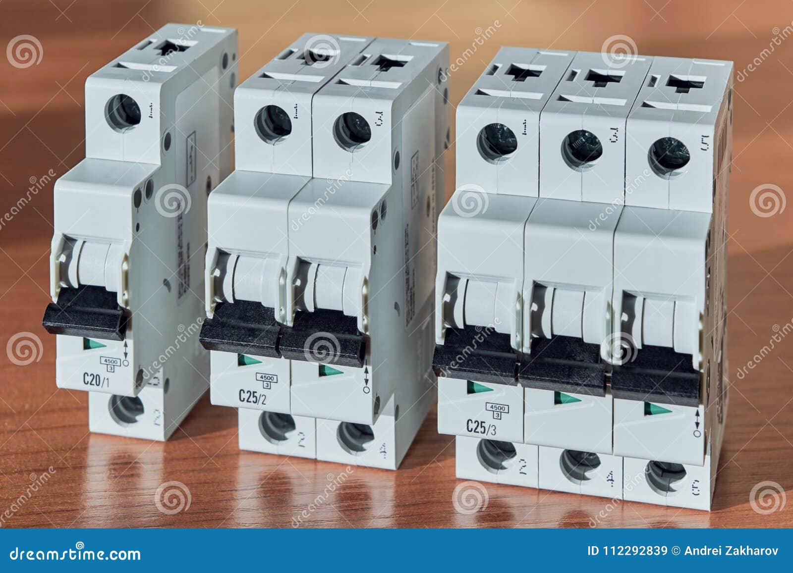 Three Modular Electrical Circuit Breakers Lie on the Table. Stock Image ...