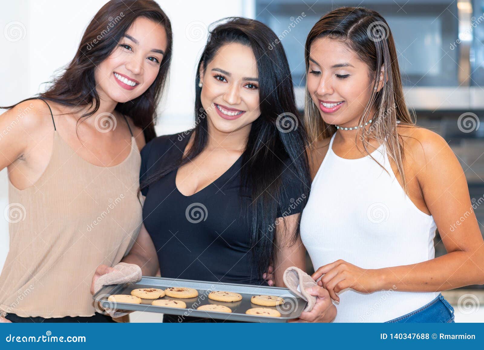 Three Moms in the Kitchen stock photo. Image of motherhood - 140347688