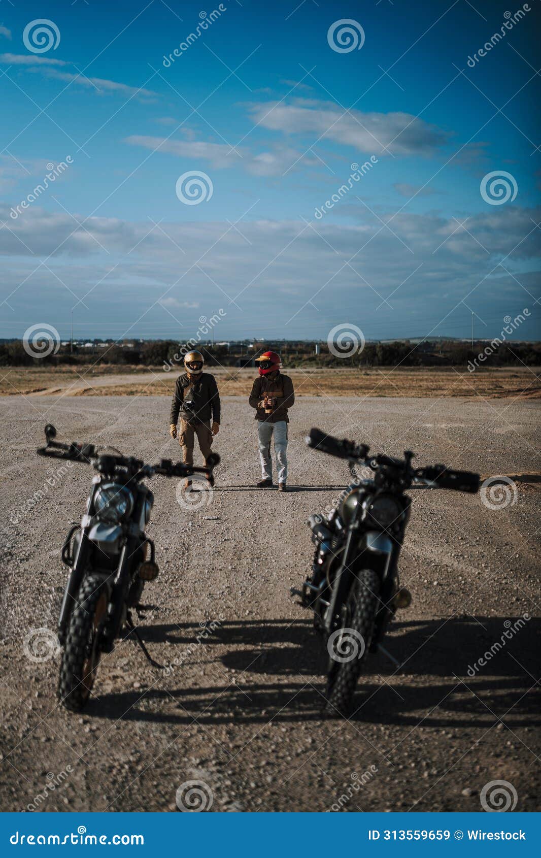 Three Motorcycles are Parked in the Middle of a Desert Field Stock ...