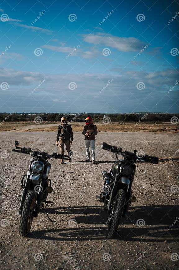 Three Motorcycles are Parked in the Middle of a Desert Field Stock ...