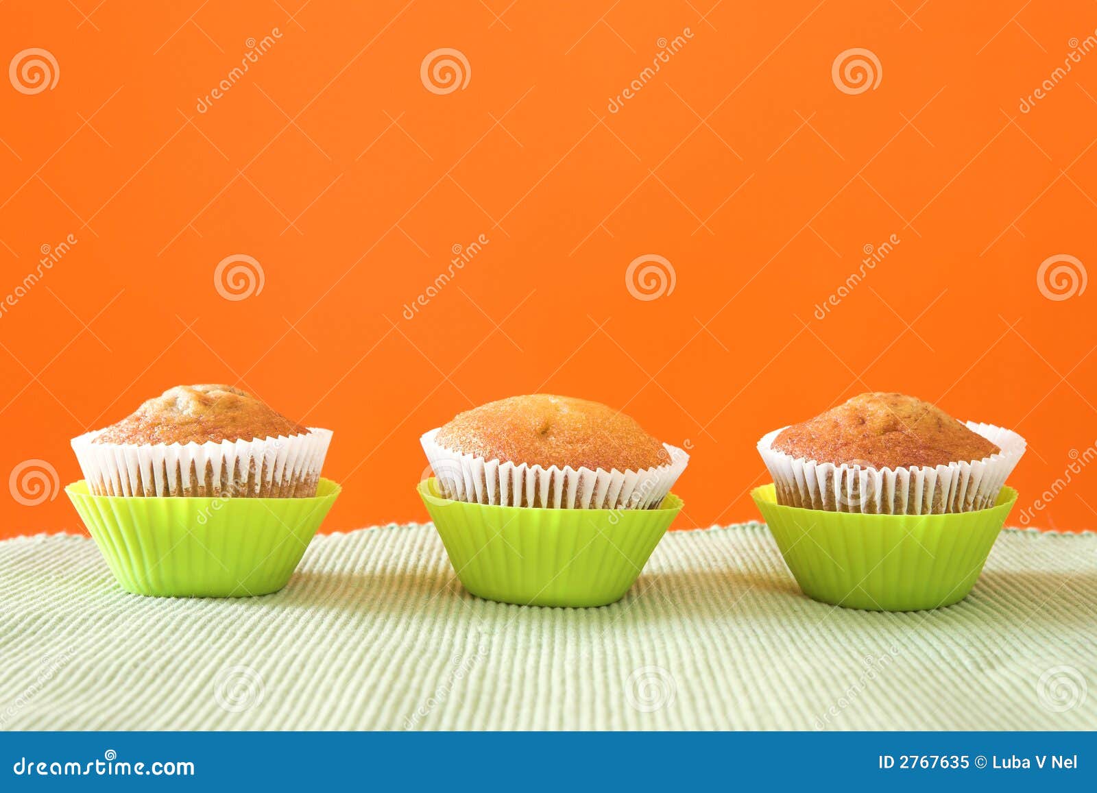 Three Muffins in Green Cups Stock Image - Image of confectionary ...