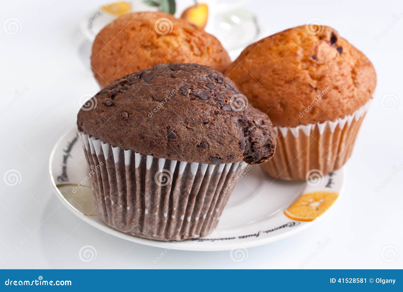 Three muffins on a plate stock image. Image of chocolate - 41528581