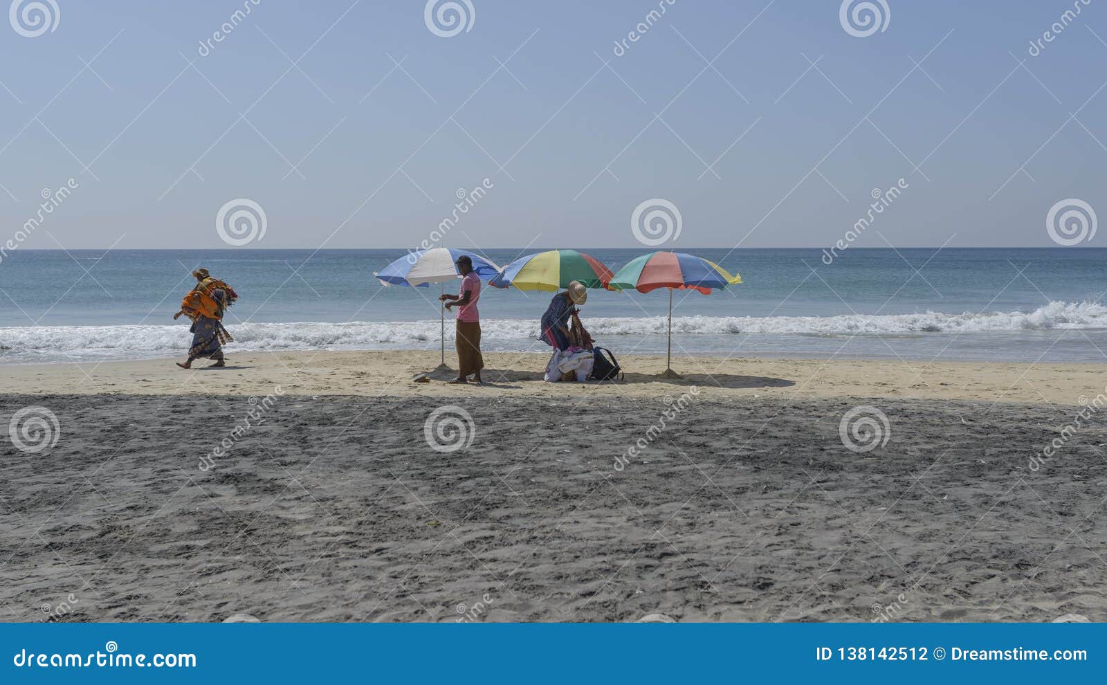 Three Beach Umbrellas, Blue Sky and Ocean. Editorial Photography ...