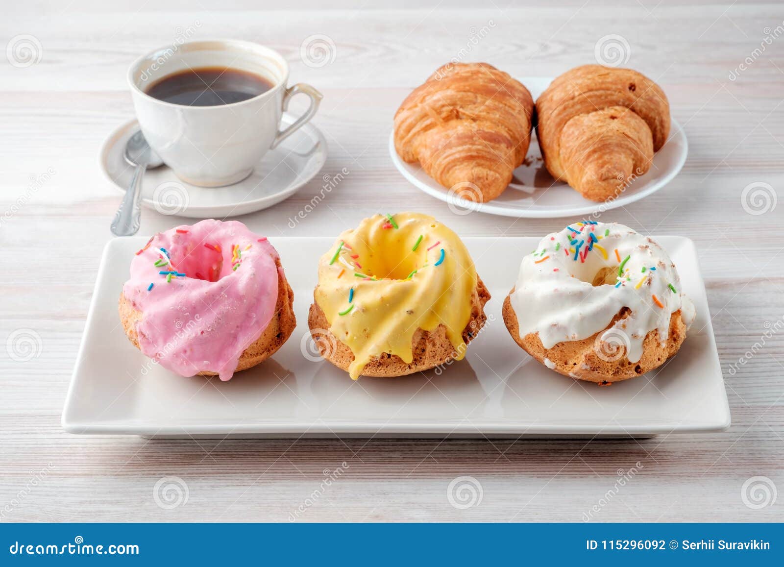 Three Multi-colored Cupcakes on a Rectangular Plate. Stock Photo ...