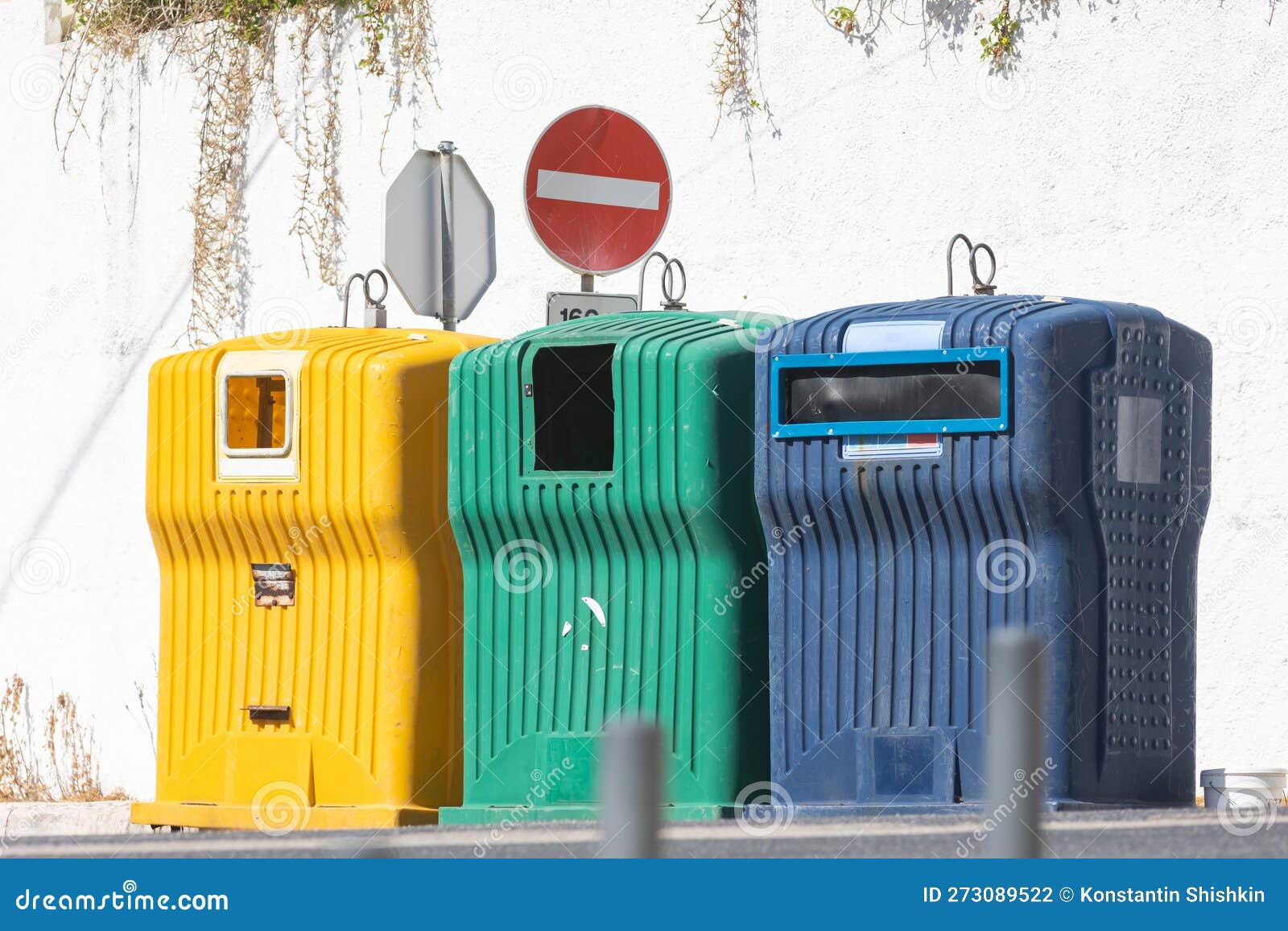 Three Multi-colored Garbage Cans for Sorted Garbage Outdoors Stock ...