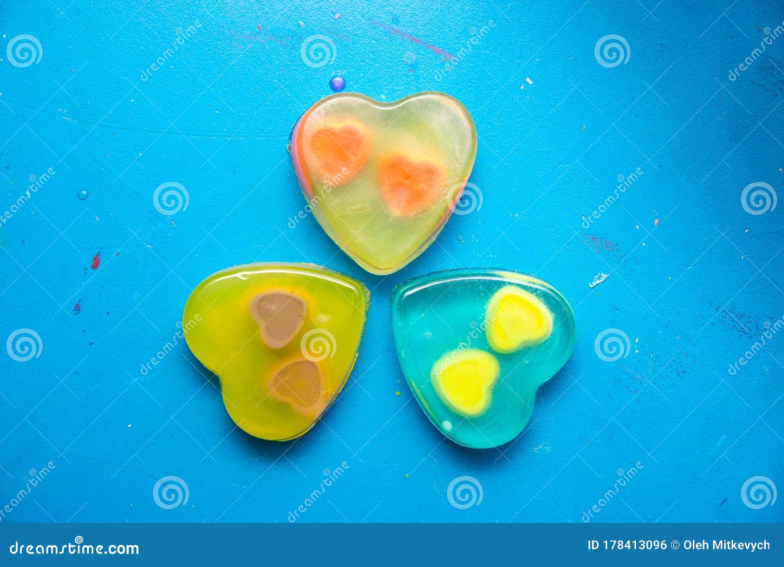 Three Multi-colored Handmade Soaps in the Form of a Heart on a Blue ...