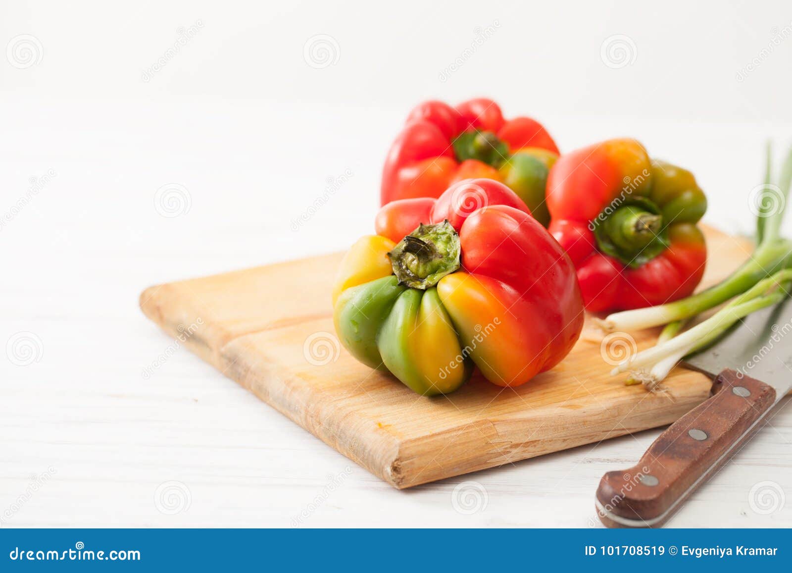 Three Multi-colored Peppers on a White Table Stock Image - Image of ...