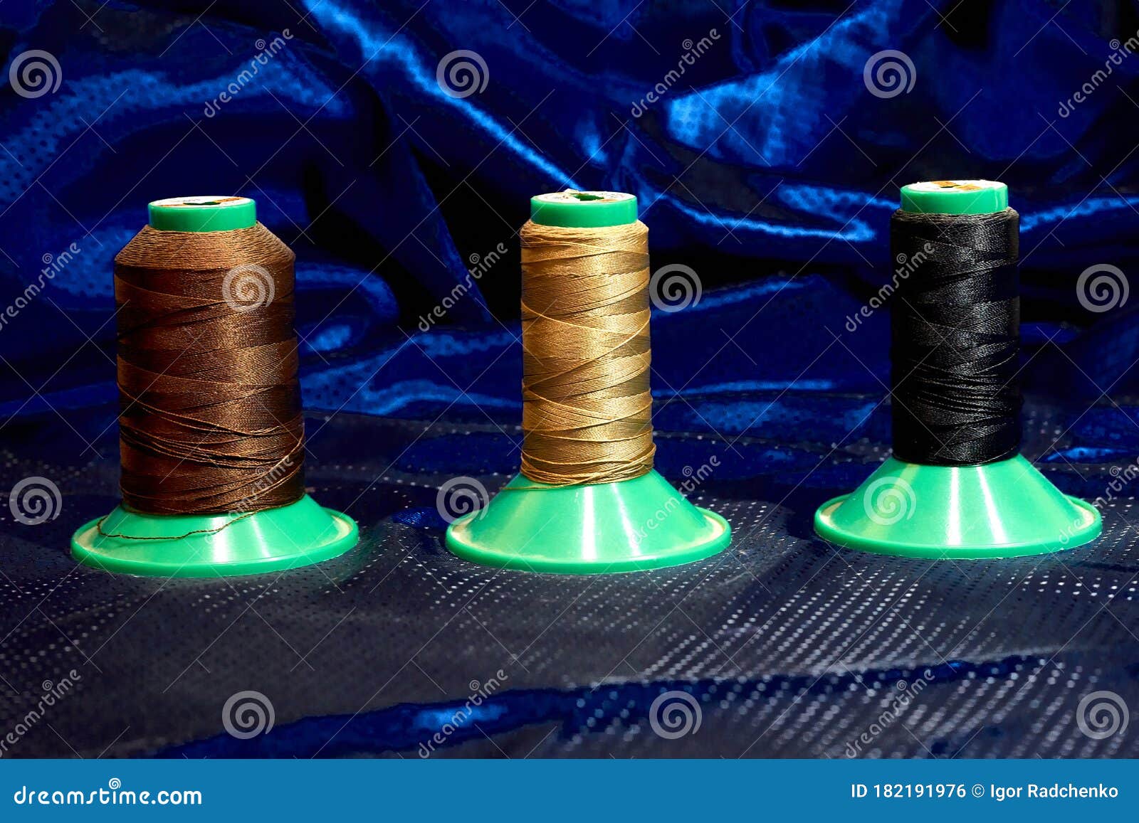 Three Multi-colored Spools of Thread Stock Photo - Image of brown ...