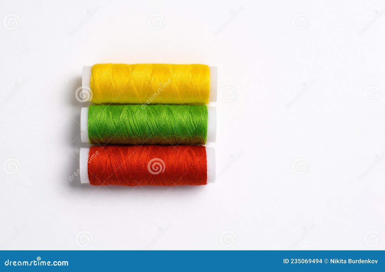 Three Multi-colored Spools of Thread for Sewing are Stacked in the Form ...