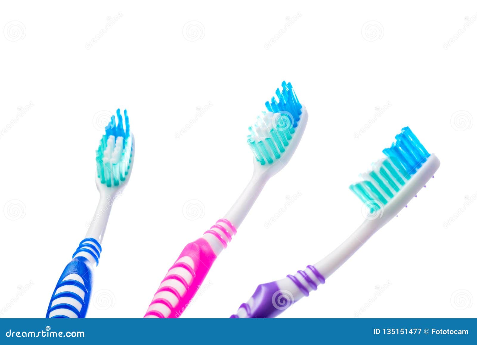 Three Multi-colored Toothbrushes on Isolated White Background Stock ...