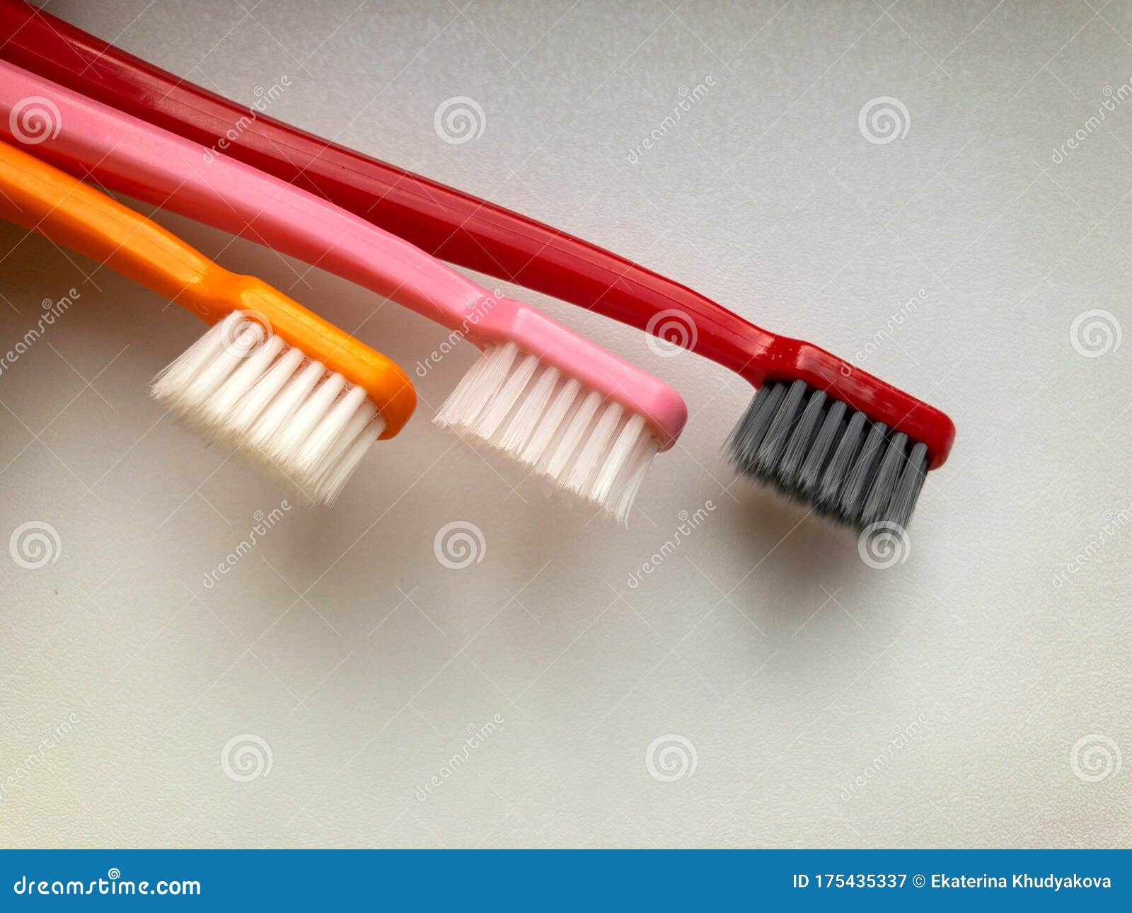 Three Multi-colored Toothbrushes on a White Background Stock Image ...