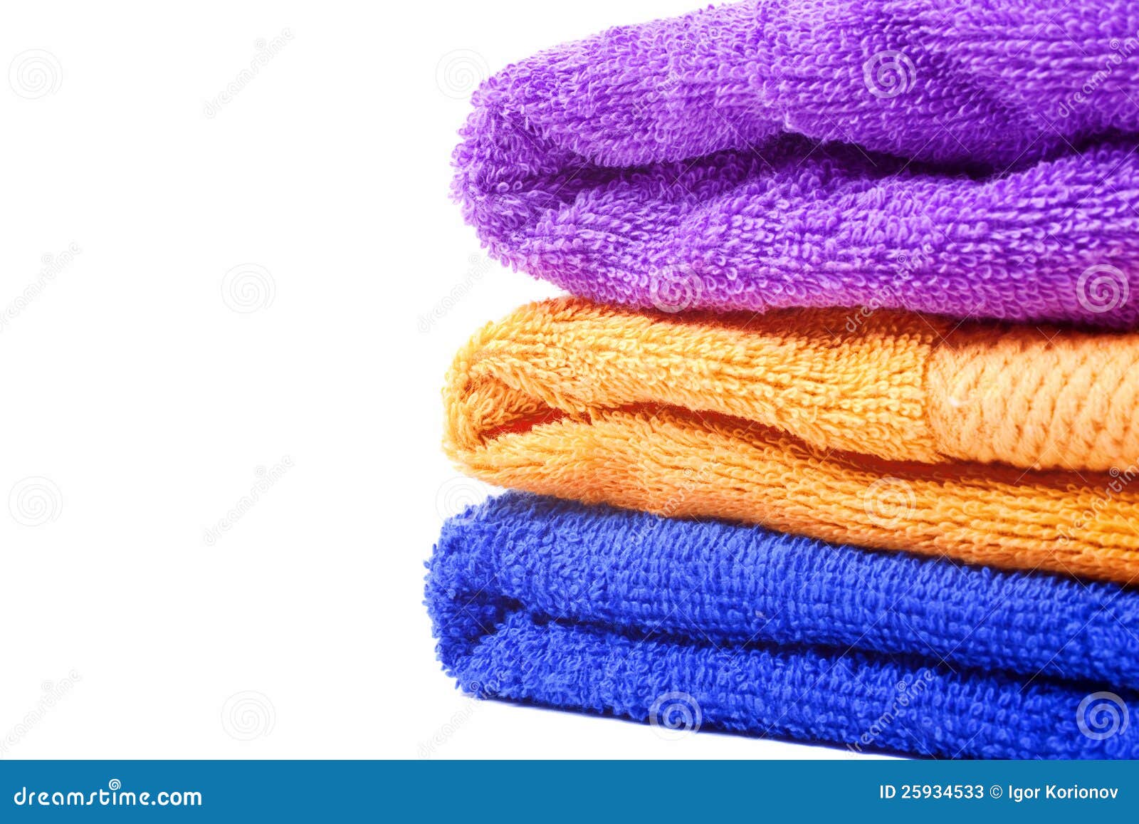Three multi-colored towels stock image. Image of cotton - 25934533
