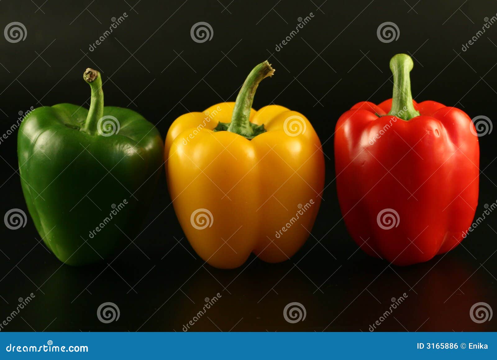 Three Multi-colored Heart-shaped Mousse Cakes Against A Dark Background ...