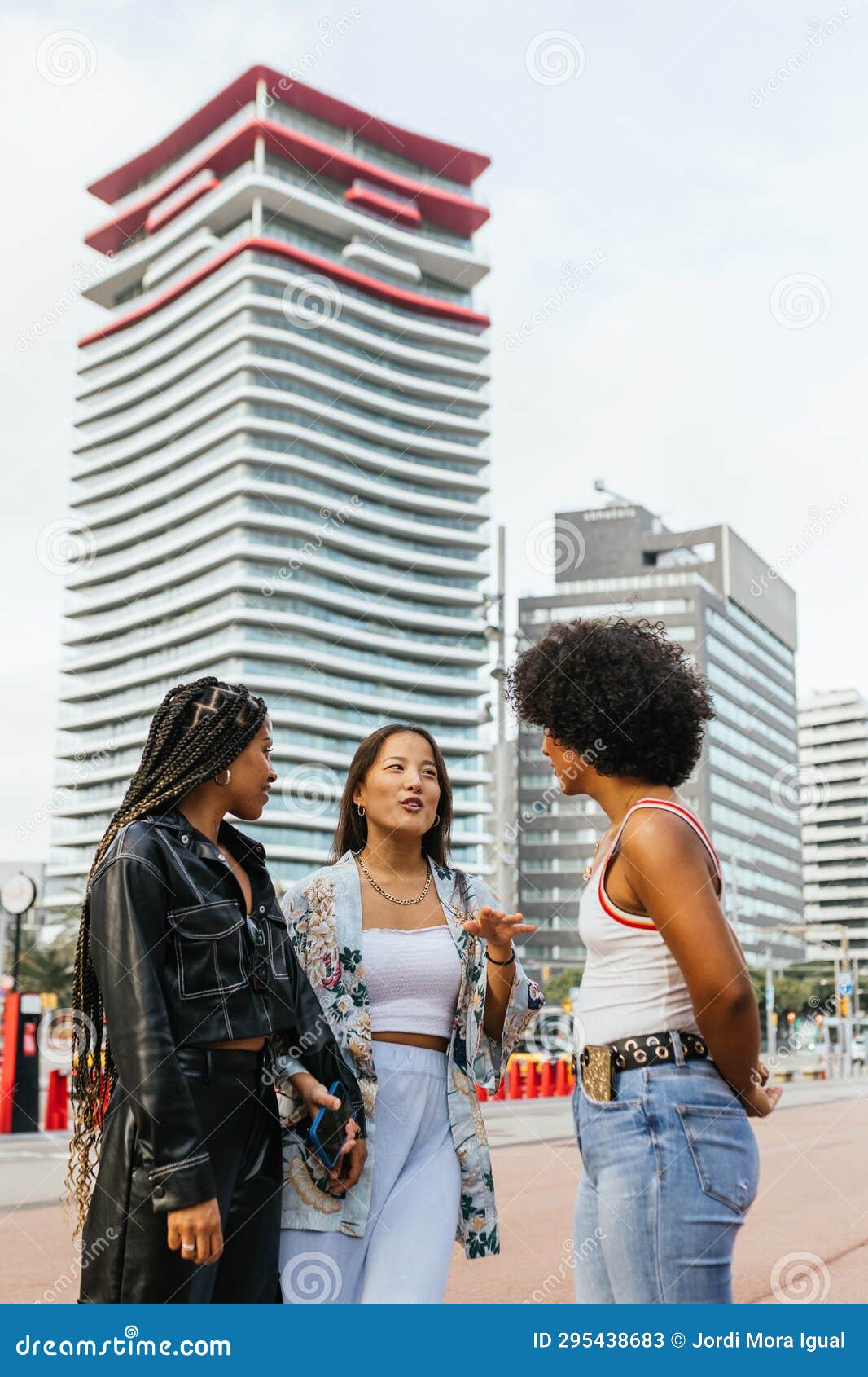 Three Multi-ethnic and Multi-gender People Talking in the City Stock ...