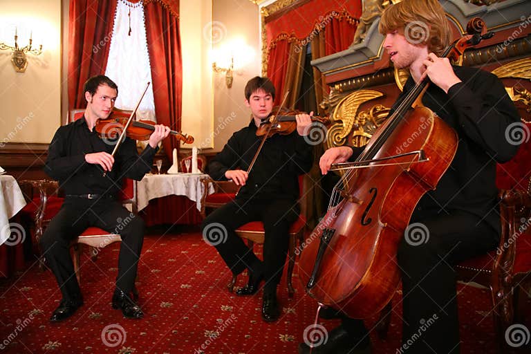 Three musicians stock image. Image of music, chair, decoration - 9158455