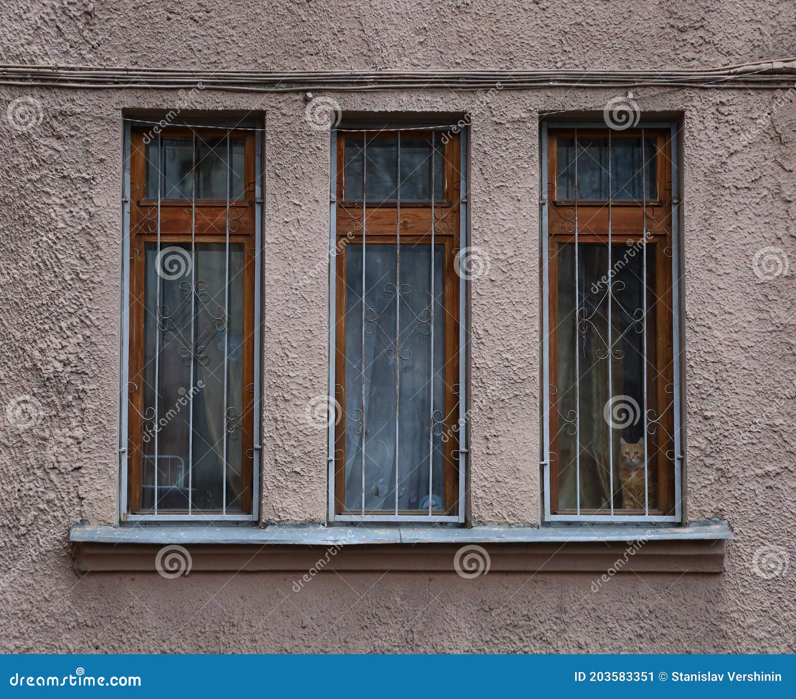 Three Narrow Barred Windows in the Wall of the House Stock Image ...