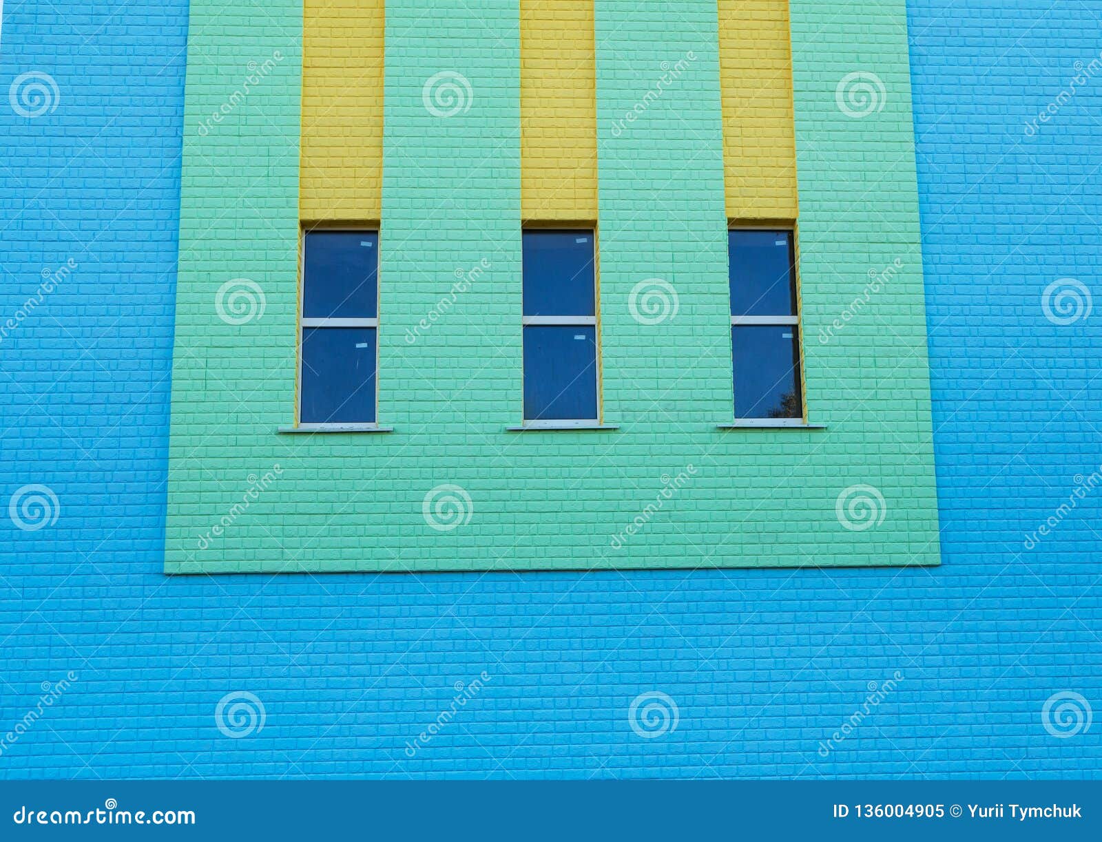Three Narrow Vertical Windows on the Blue Brick Wall, Bottom View Stock ...