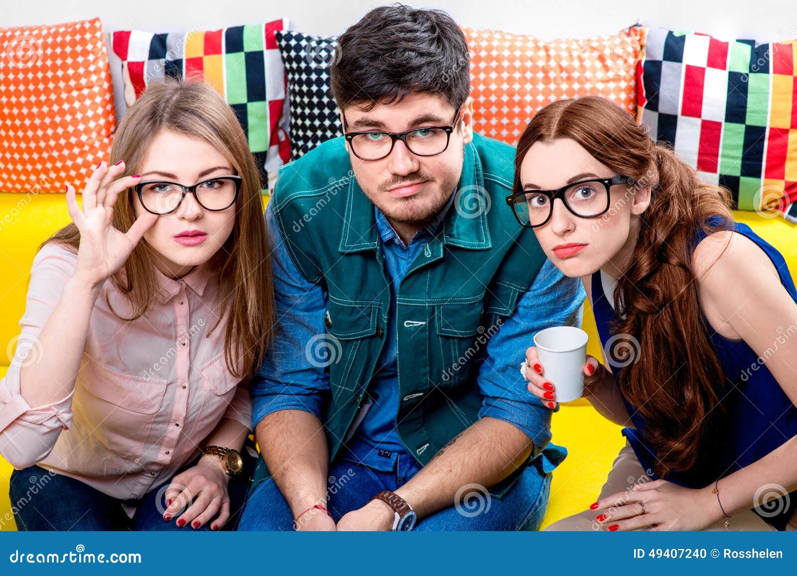 Three nerds on the couch stock photo. Image of eyeglasses - 49407240