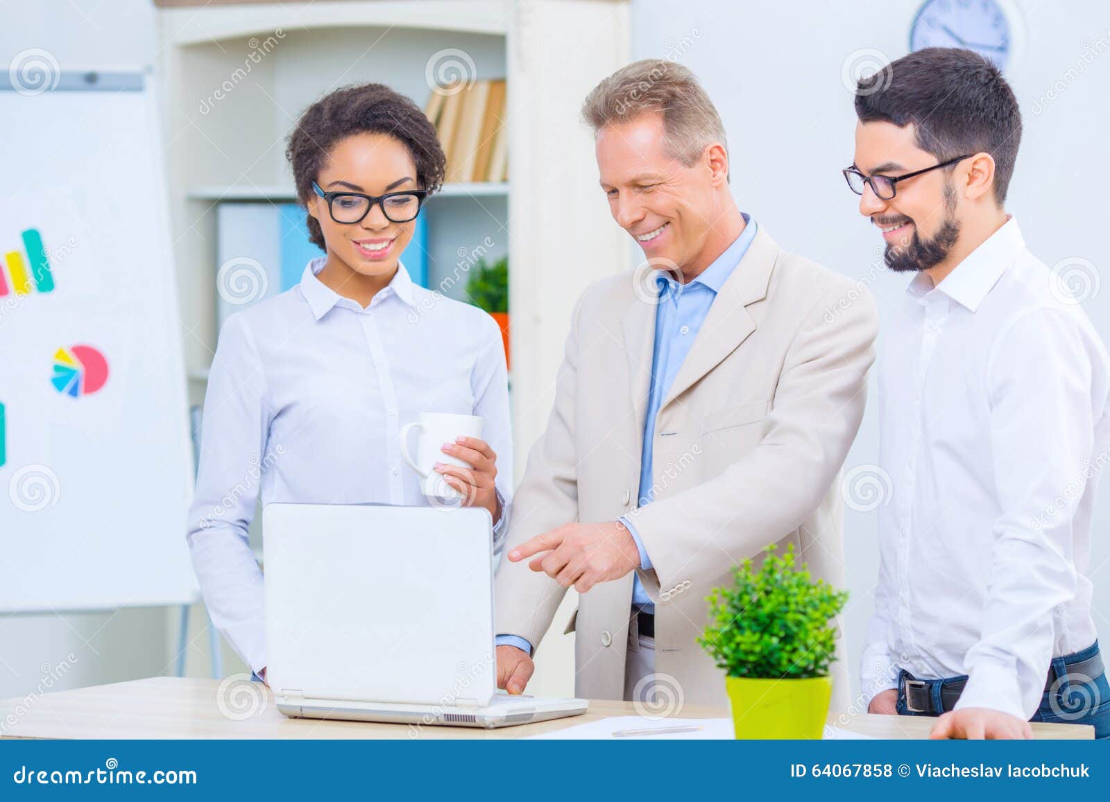 Three Office Workers Discussing a Project Stock Photo - Image of female ...