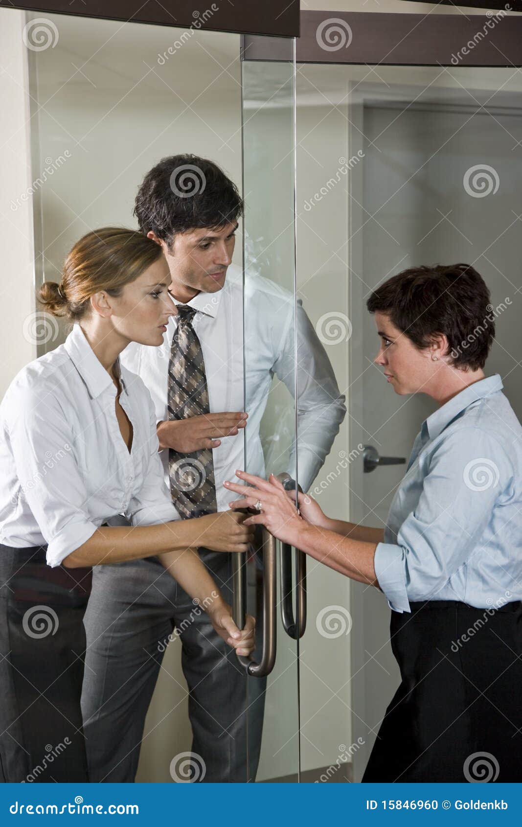 Three Office Workers at Door of Boardroom Stock Photo - Image of ...