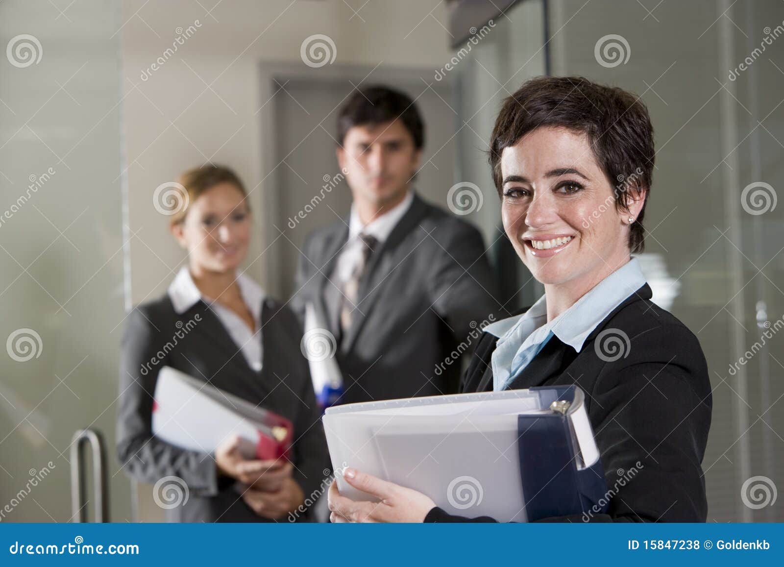 Three Office Workers at Door of Boardroom Stock Photo - Image of ...
