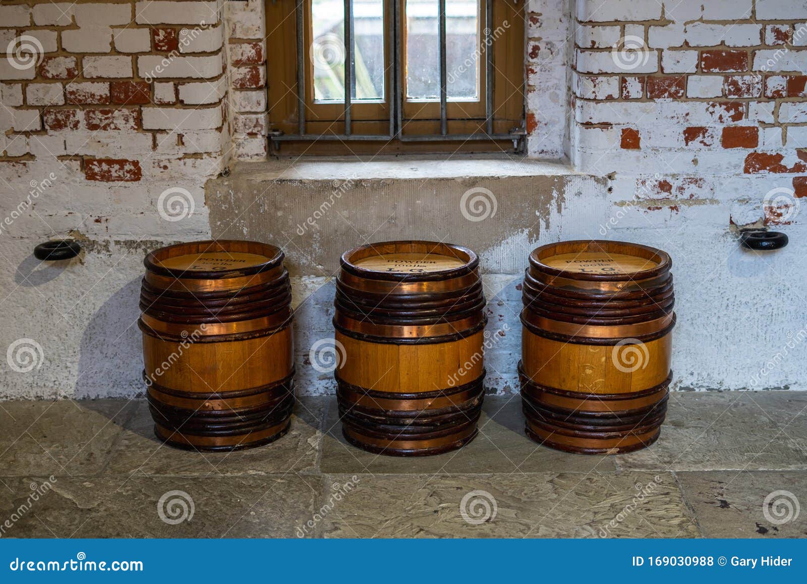 Three Old Barrels Used To Transport Rum in a Row in a Cellar Stock ...