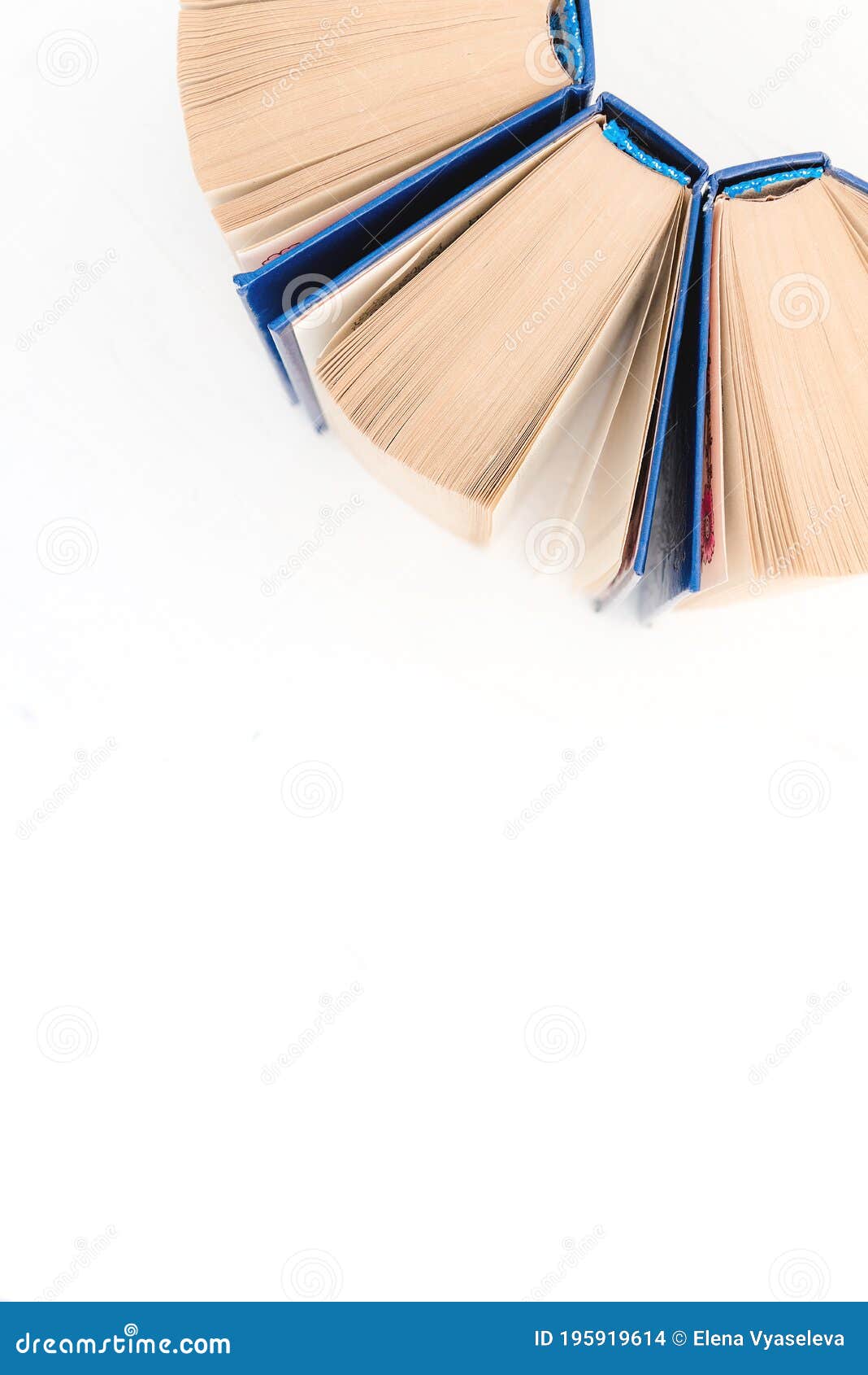 Three Old Books Standing on White Table. Top View Vertical Photo Stock ...