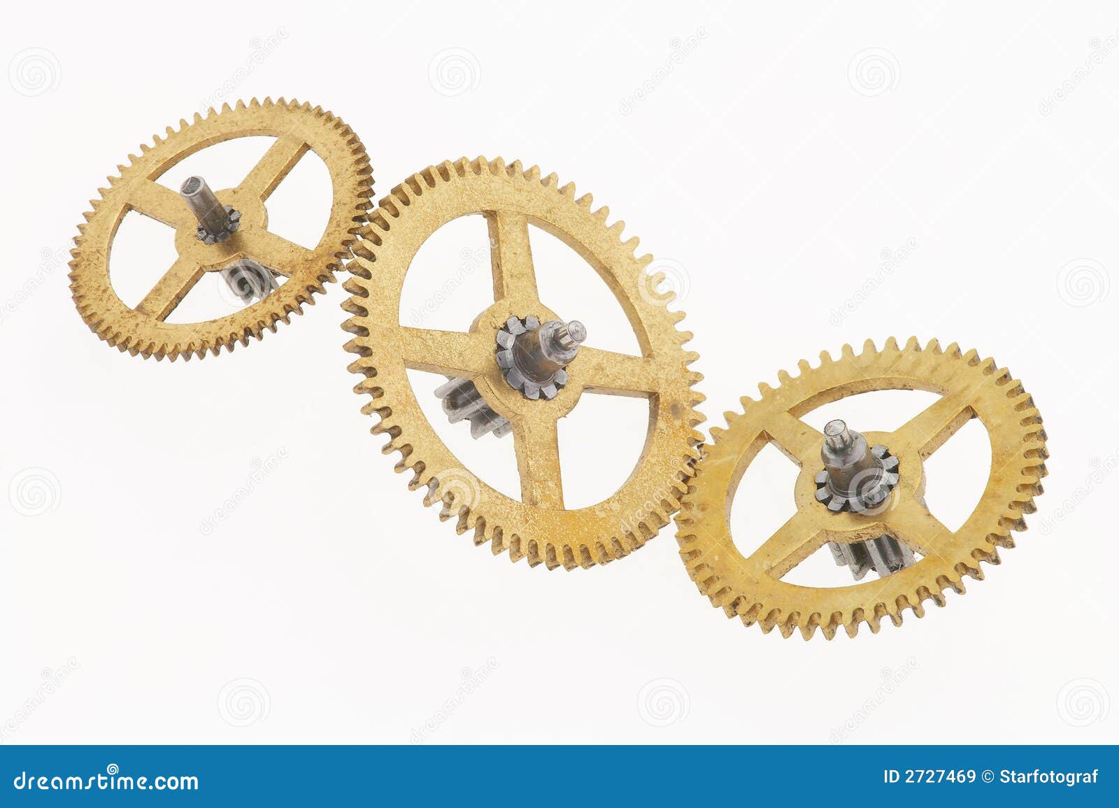 Three old golden cogwheels stock image. Image of engineering - 2727469