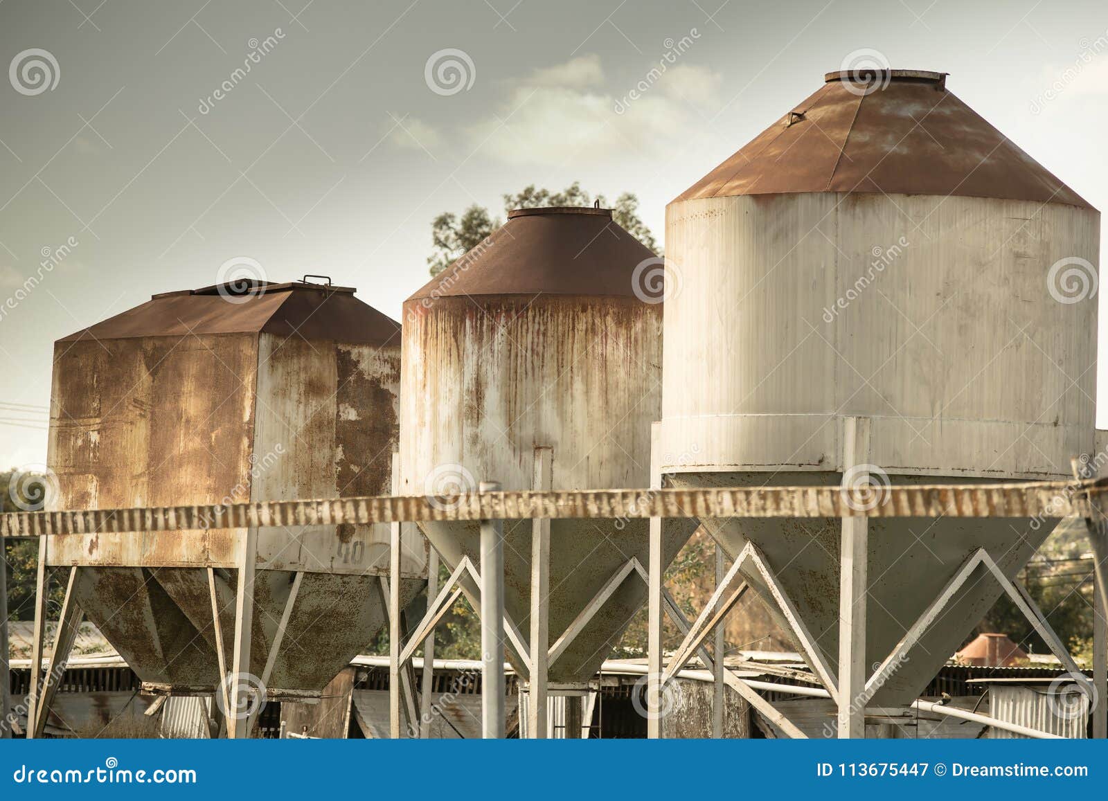Three old grain bins stock image. Image of rusty, storage - 113675447