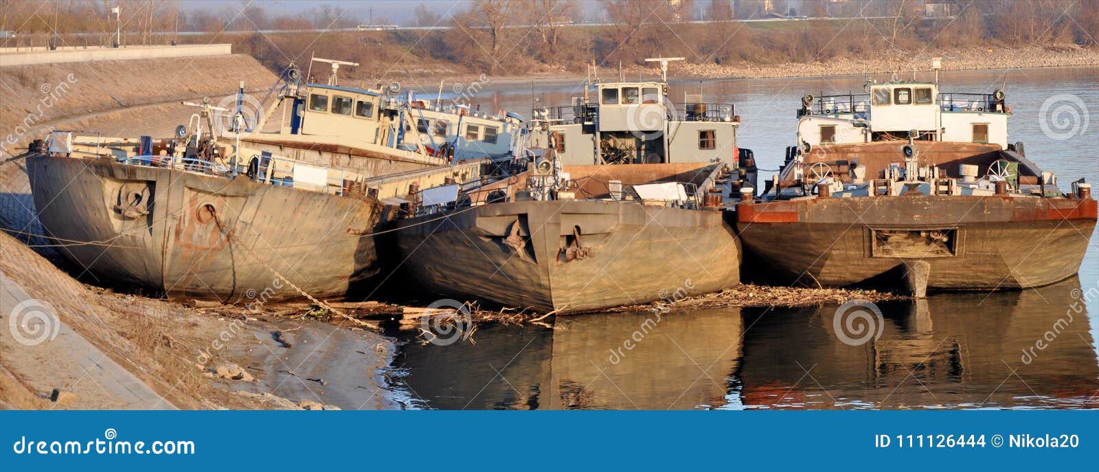 Three Old Rusty Abandoned Barges Abandoned on the River. Stock Photo ...