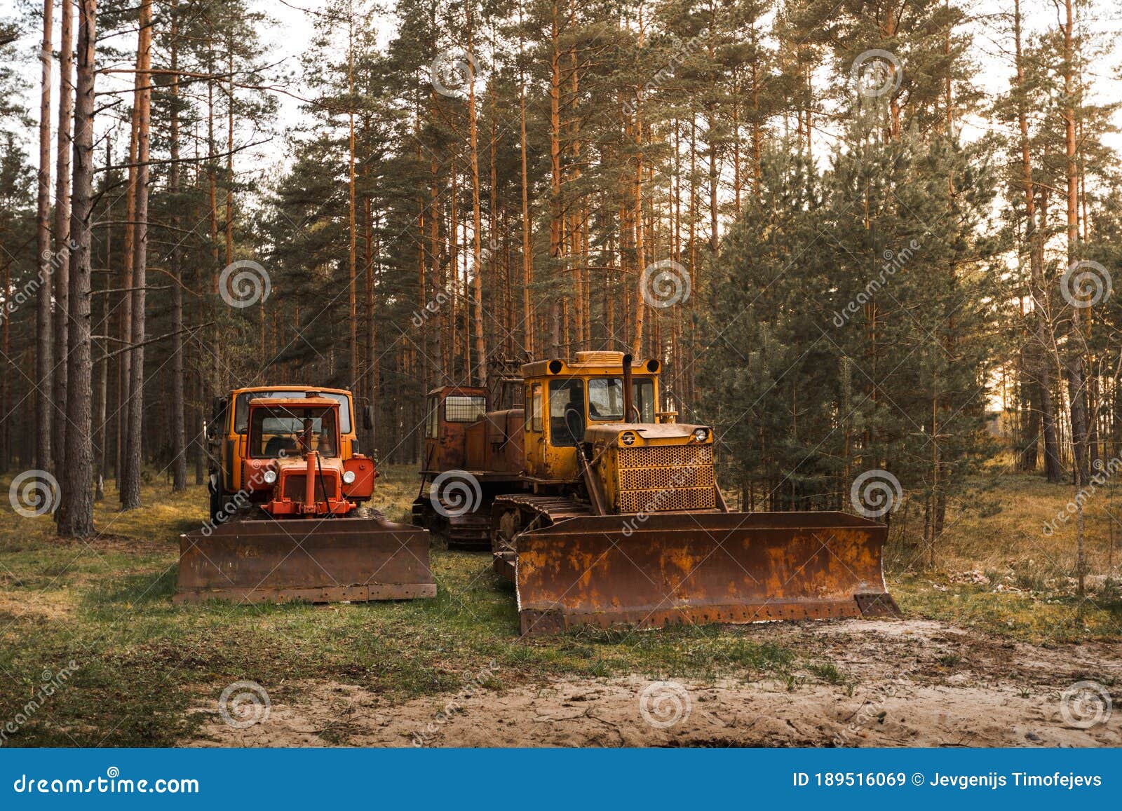 Three Old Rusty Abandoned Tractors with Huge Loader Buckets Stock Image ...