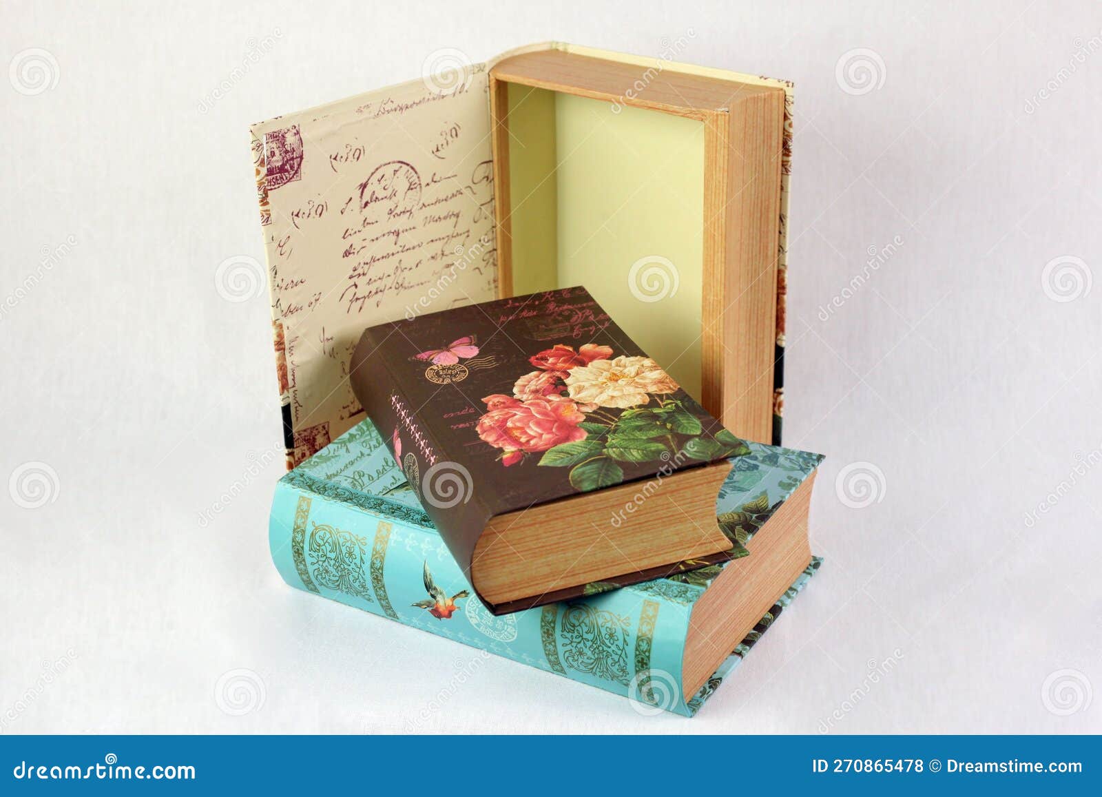 Three Open Book Boxes Featuring a Floral Pattern on the Front Cover ...