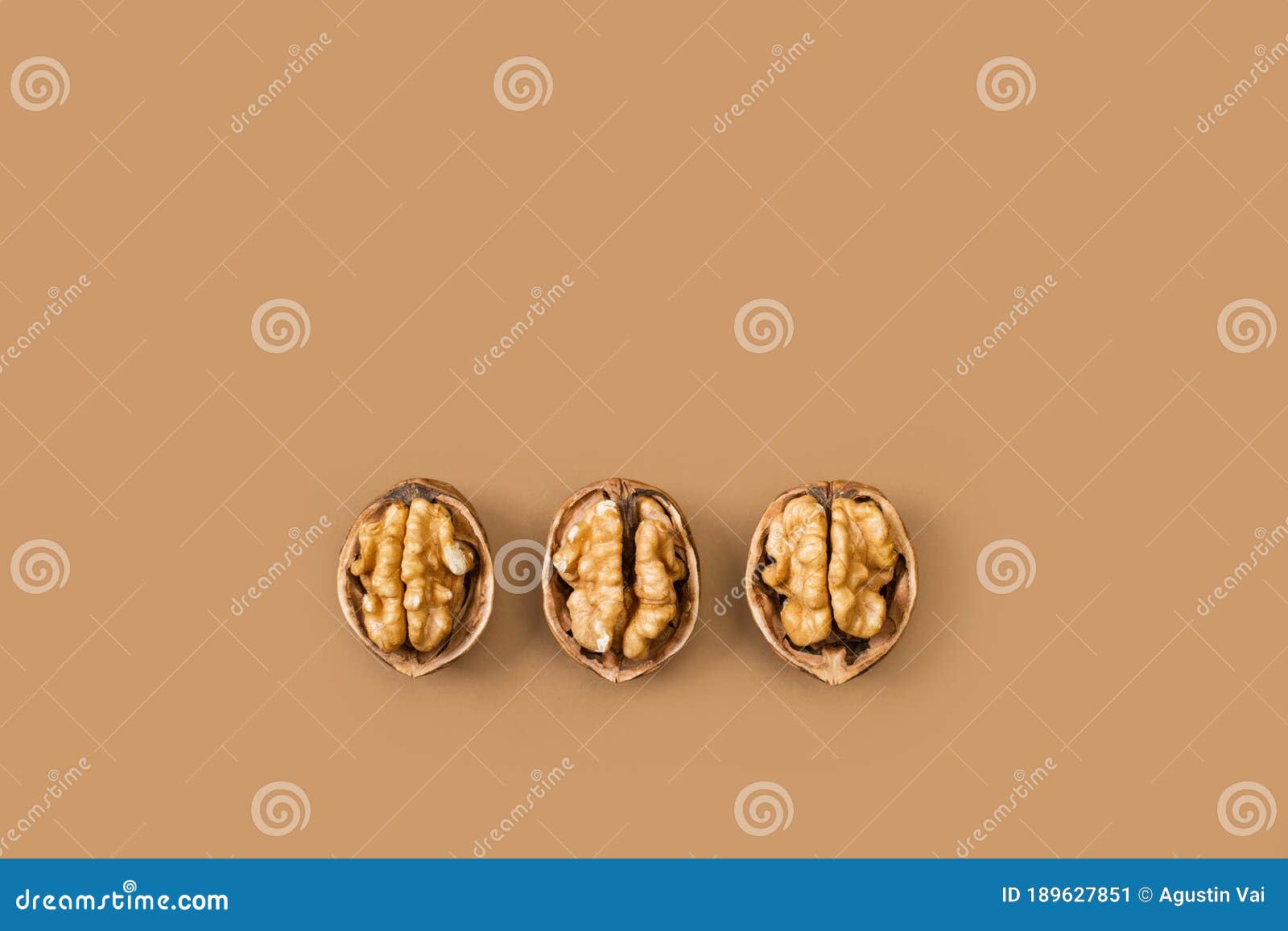 Three Open Walnuts on a Brown Background Stock Image - Image of open ...