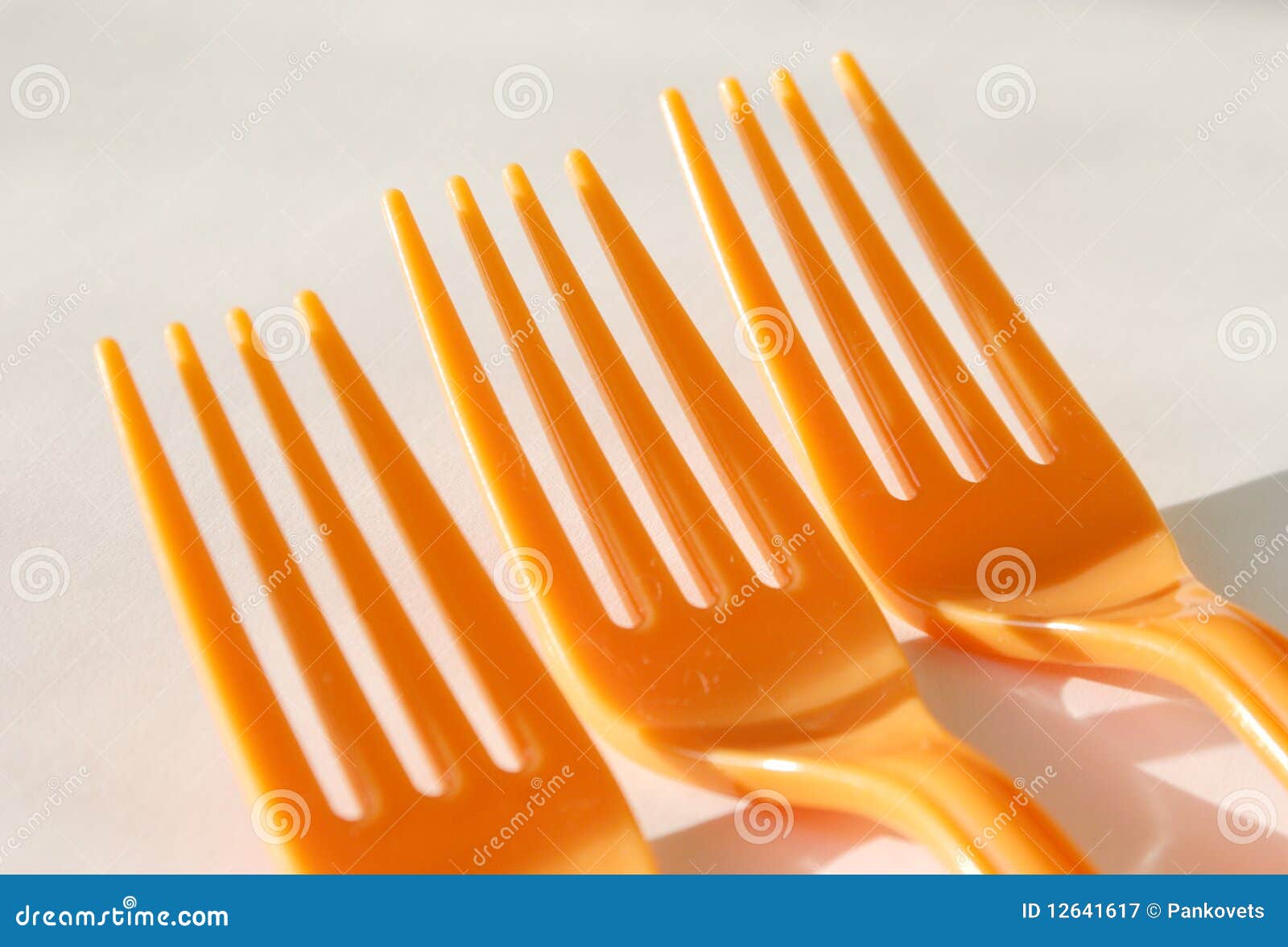 Three orange forks stock image. Image of food, kitchen - 12641617