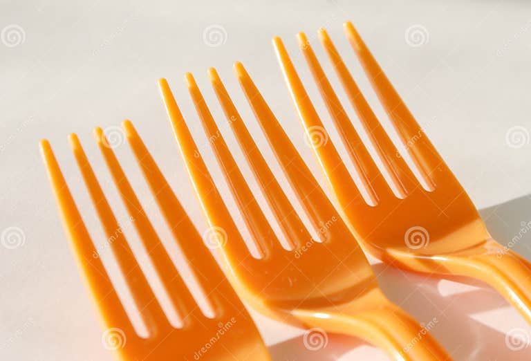 Three orange forks stock image. Image of food, kitchen - 12641617