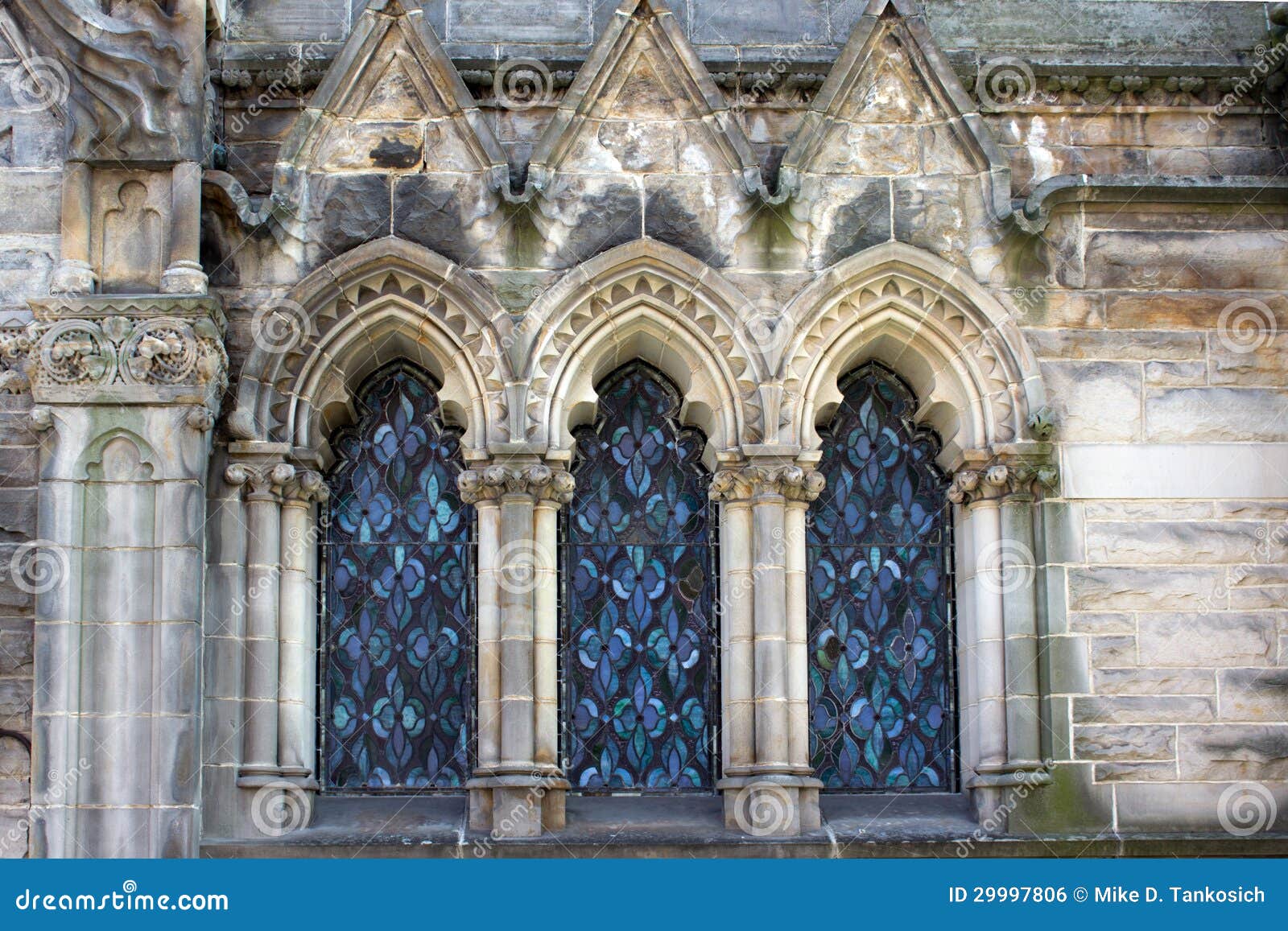 Three Blue Arched Stained Glass Windows Stock Photo - Image of arched ...