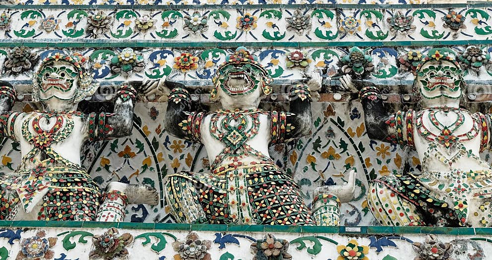 Three Ornate Statues on a Temple Wall. the Statues are of Three Figures ...
