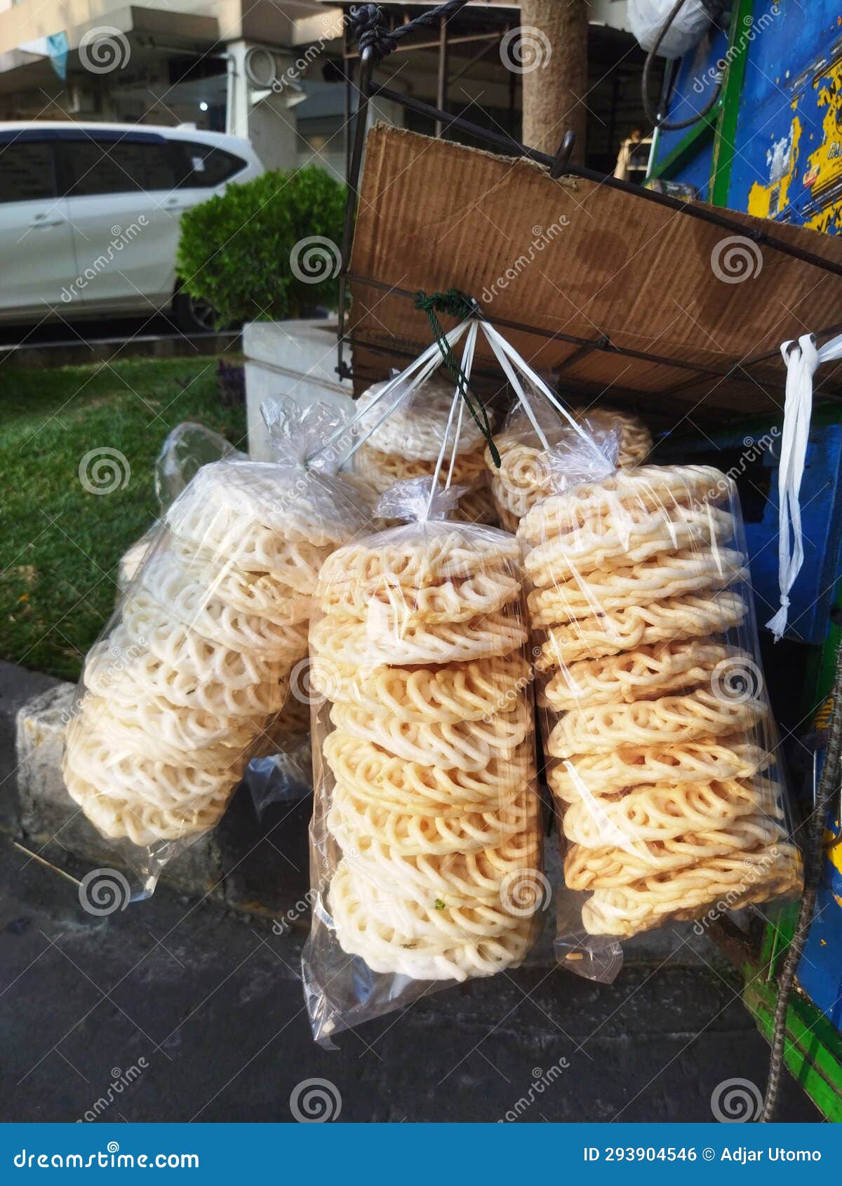 Three Packets of Round Crackers (krupuk) Hanging Down. Stock Photo ...