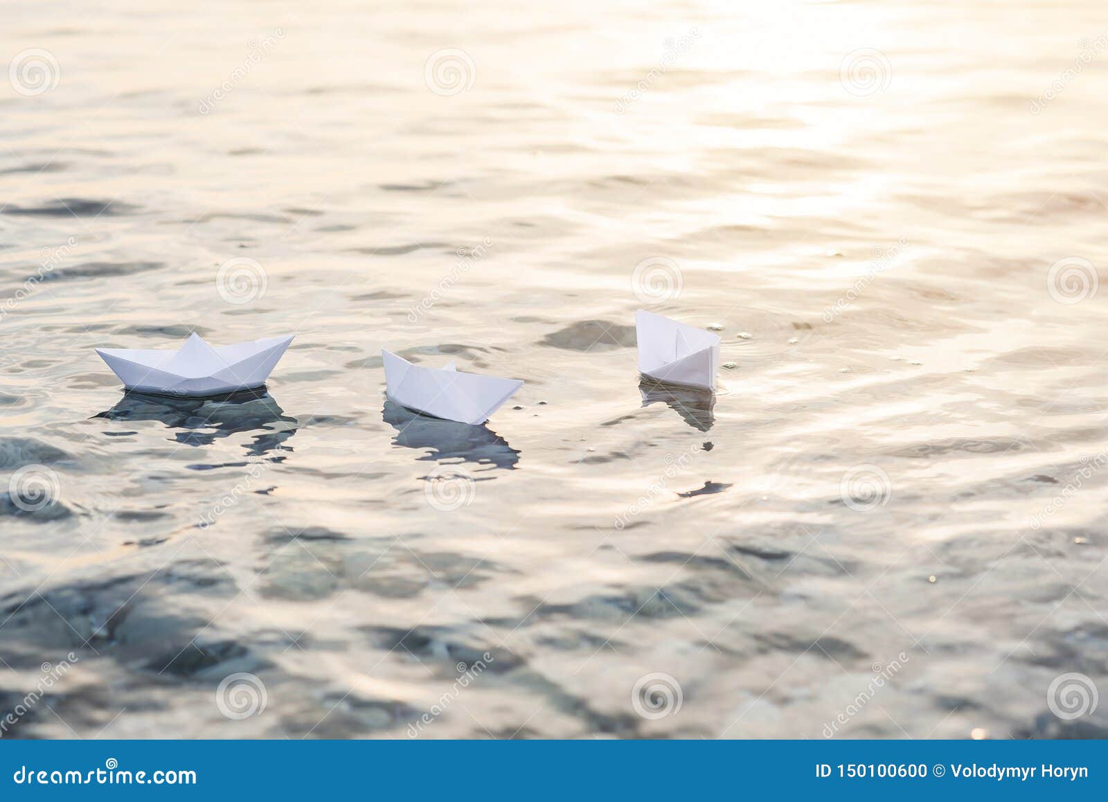 Three Paper Boats Floating in Waves on the Water at Sunset. Stock Photo ...