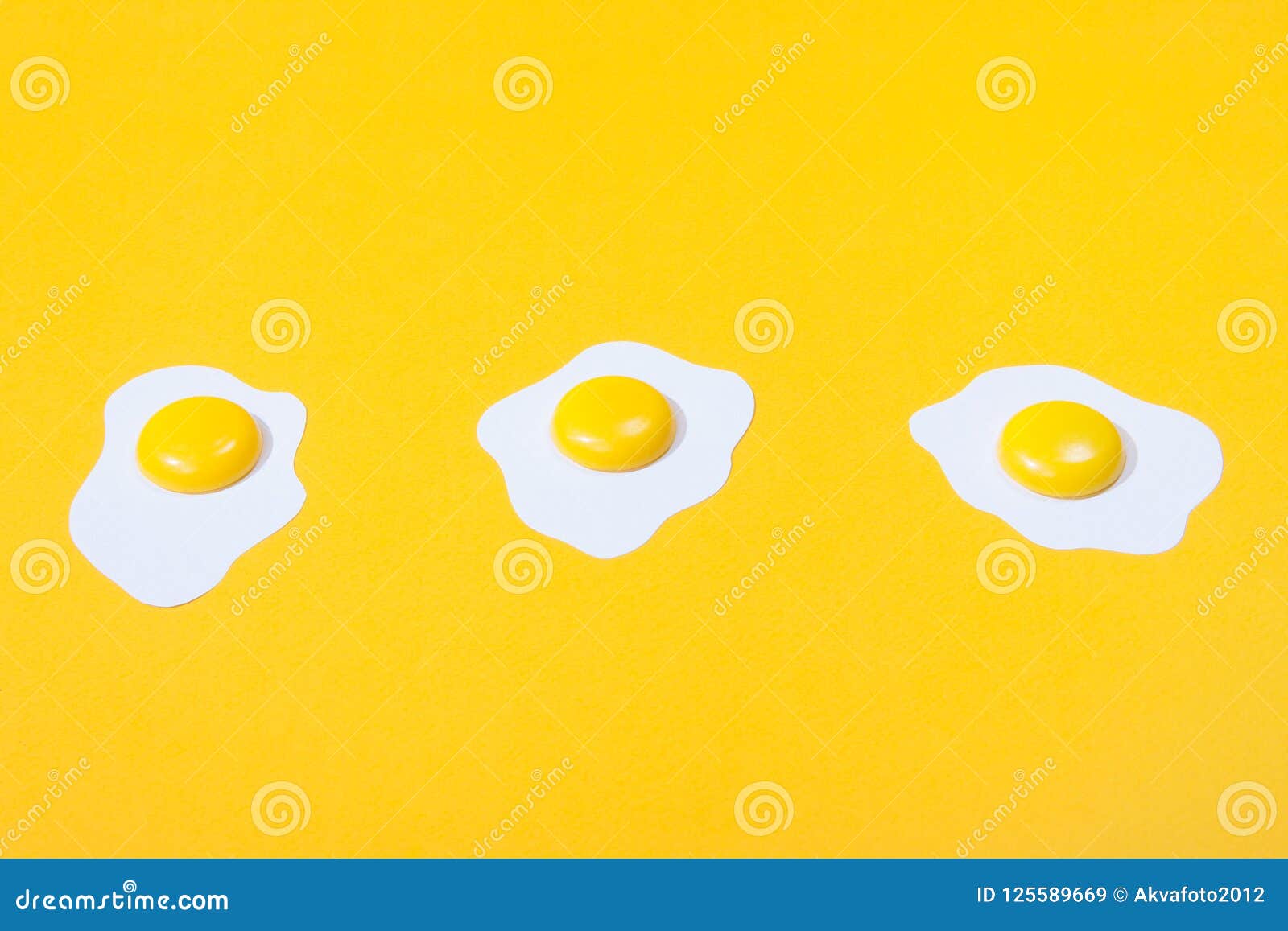 Three Paper Scrambled Eggs-fried Eggs Located on a Yellow Paper ...